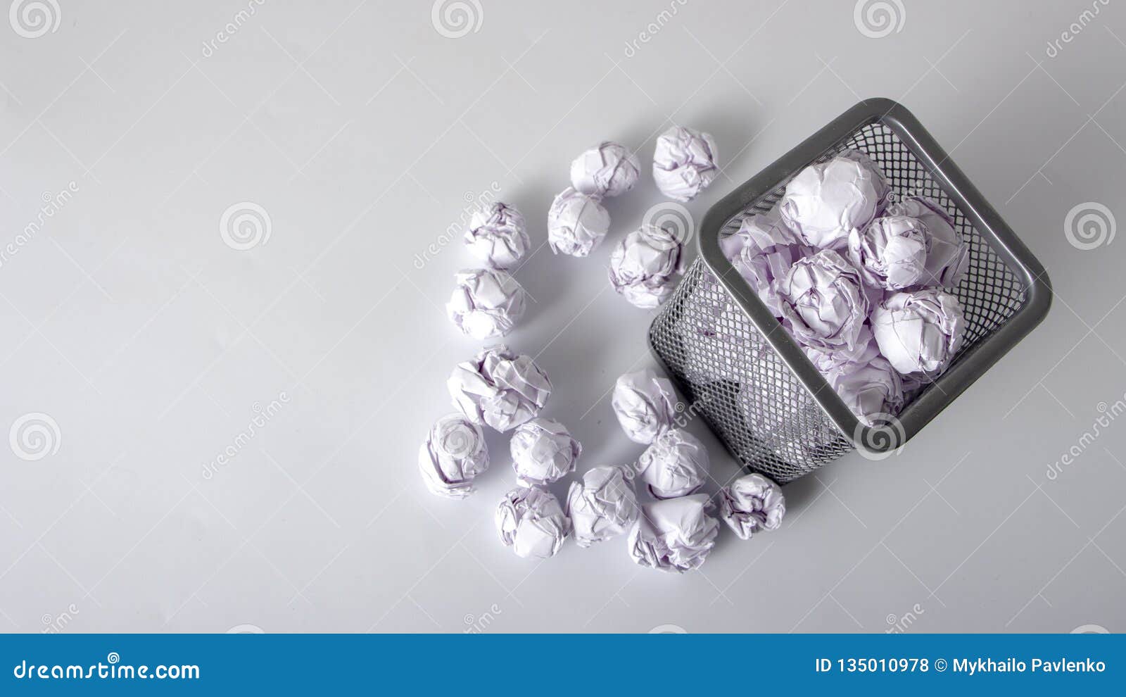 A Trashcan Full Of Crumpled Paper On White Background Close Up Royalty ...