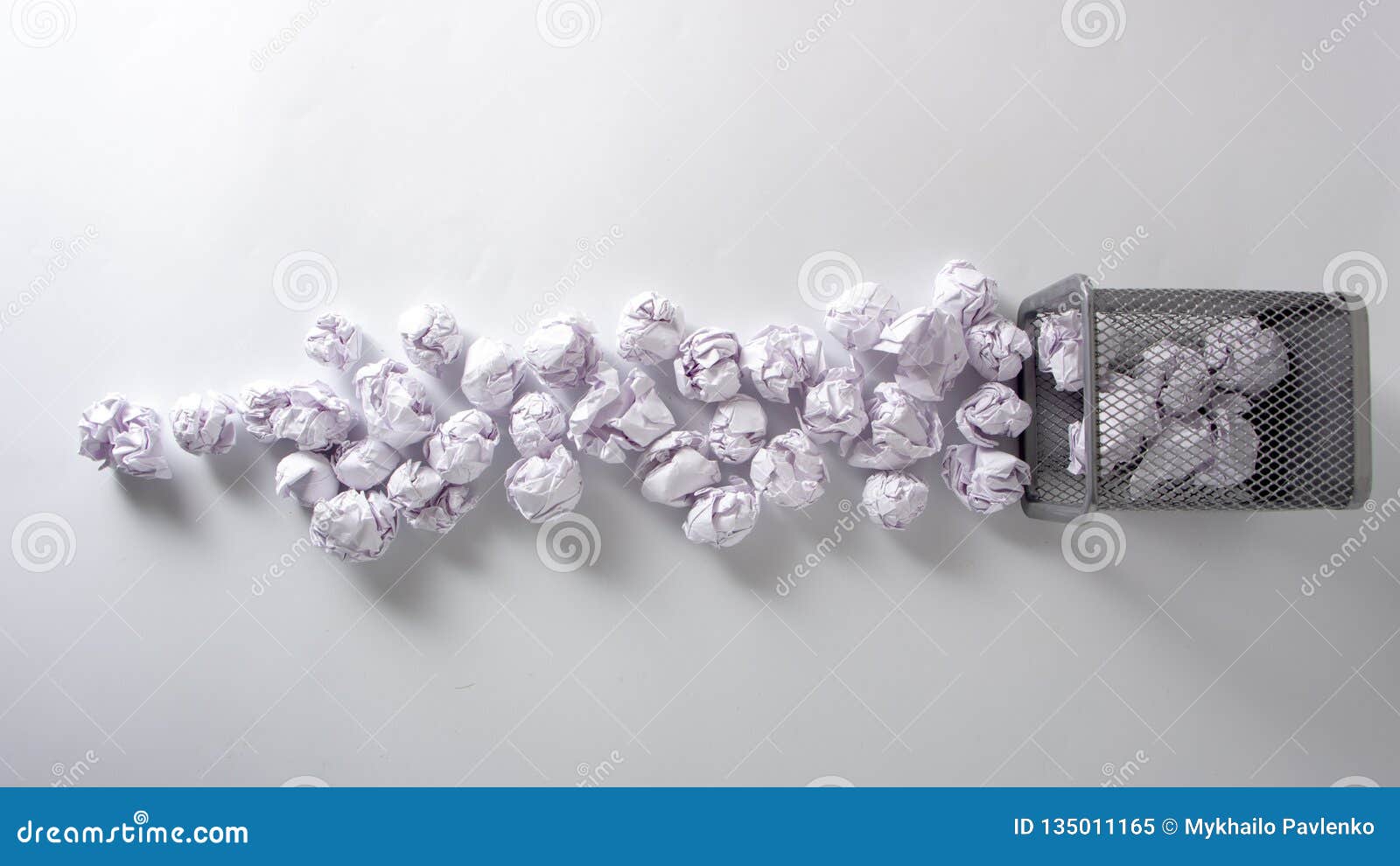 A Trashcan Full Of Crumpled Paper On White Background Close Up Stock ...
