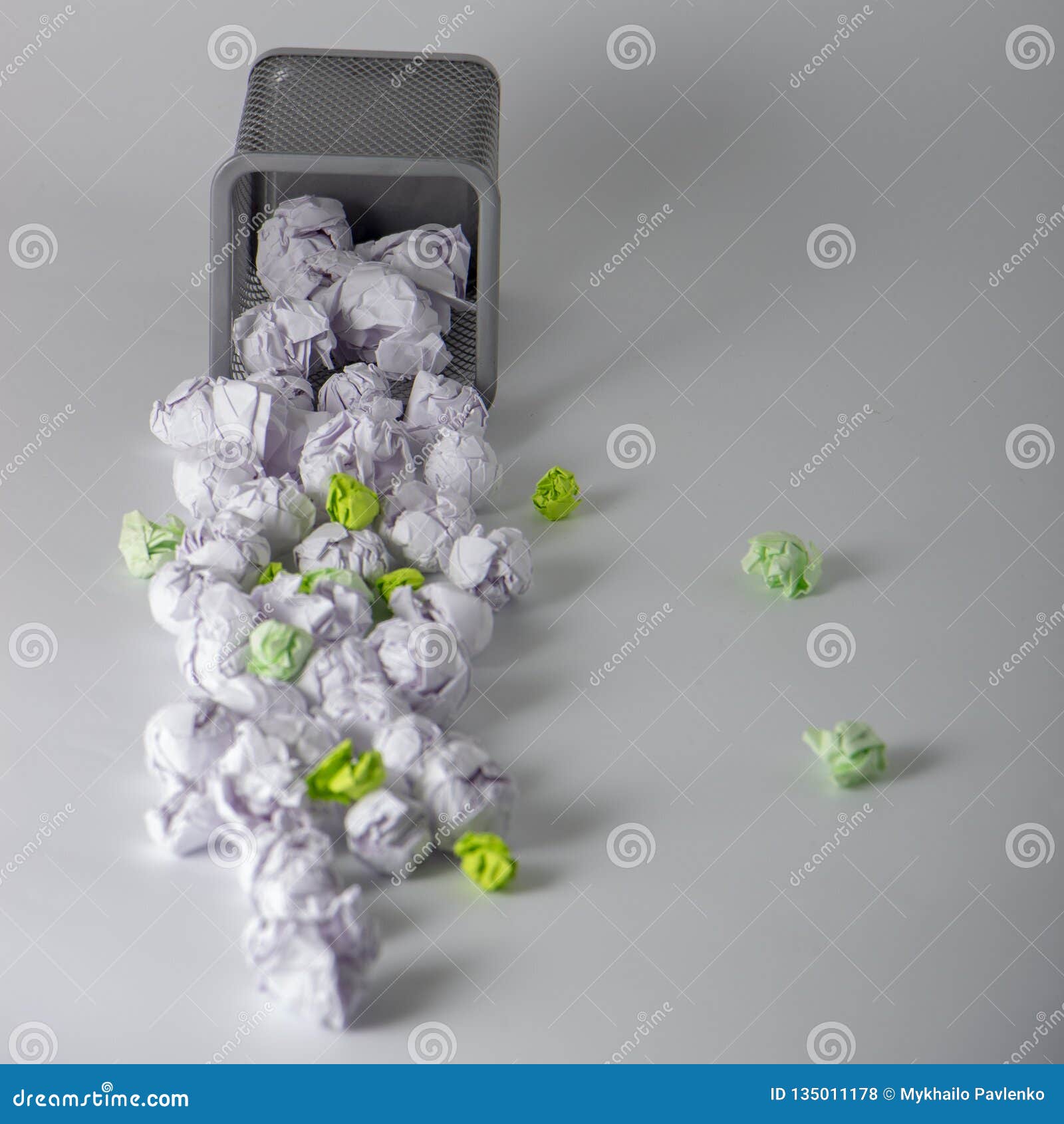 A Trashcan Full Of Crumpled Paper On White Background Close Up Royalty ...