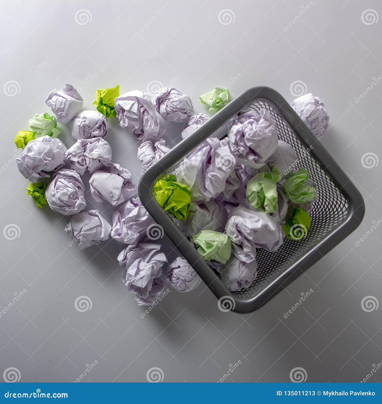 A Trashcan Full Of Crumpled Paper On White Background Close Up Stock ...