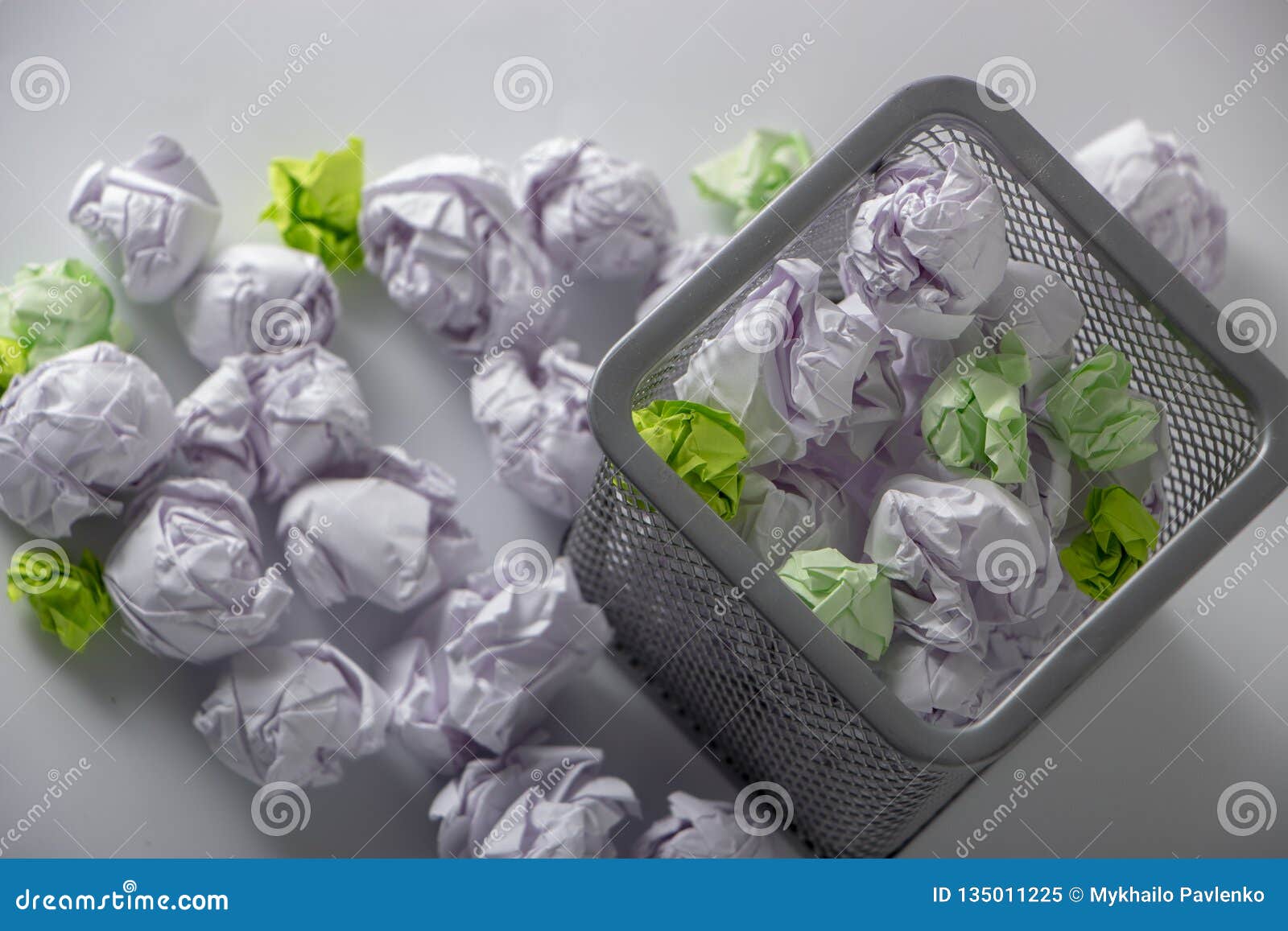 A Trashcan Full Of Crumpled Paper On White Background Close Up Stock ...