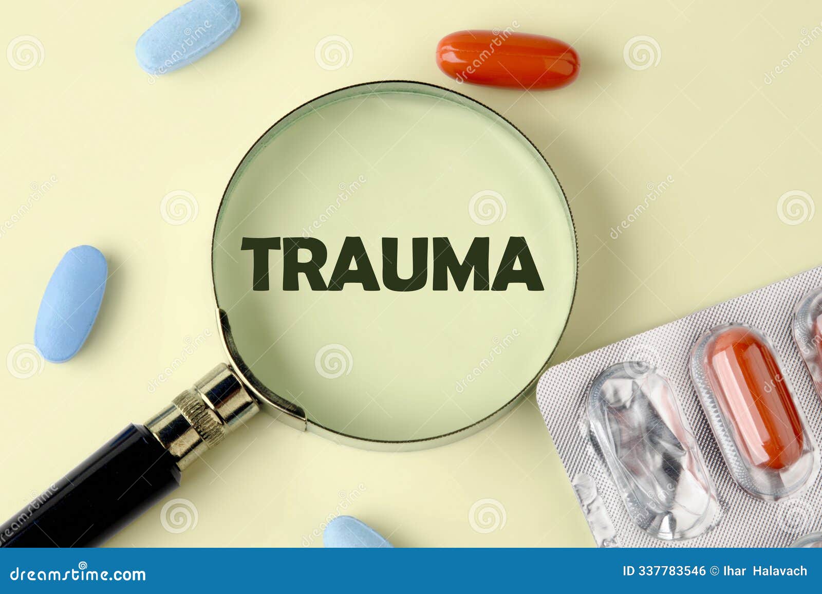 TRAUMA Written on a Yellow Background through a Magnifying Glass Close ...