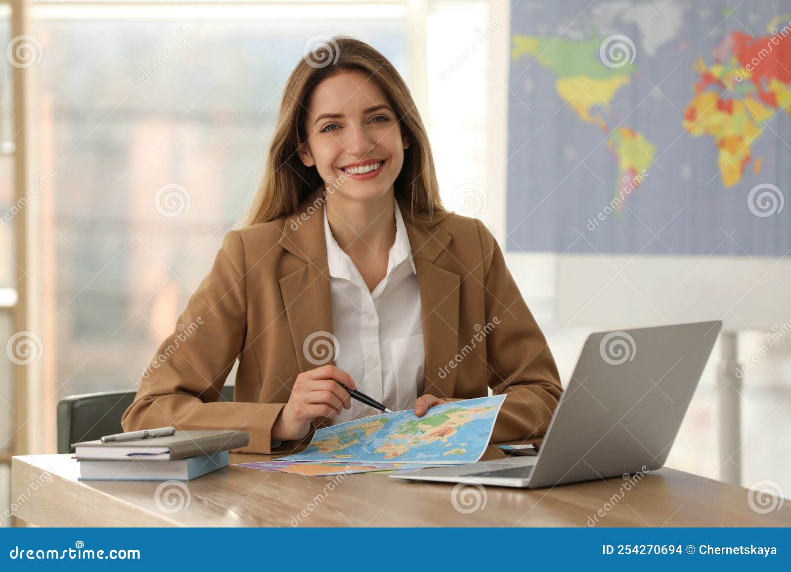Travel Agent with World Map at Table in Office Stock Photo - Image of ...