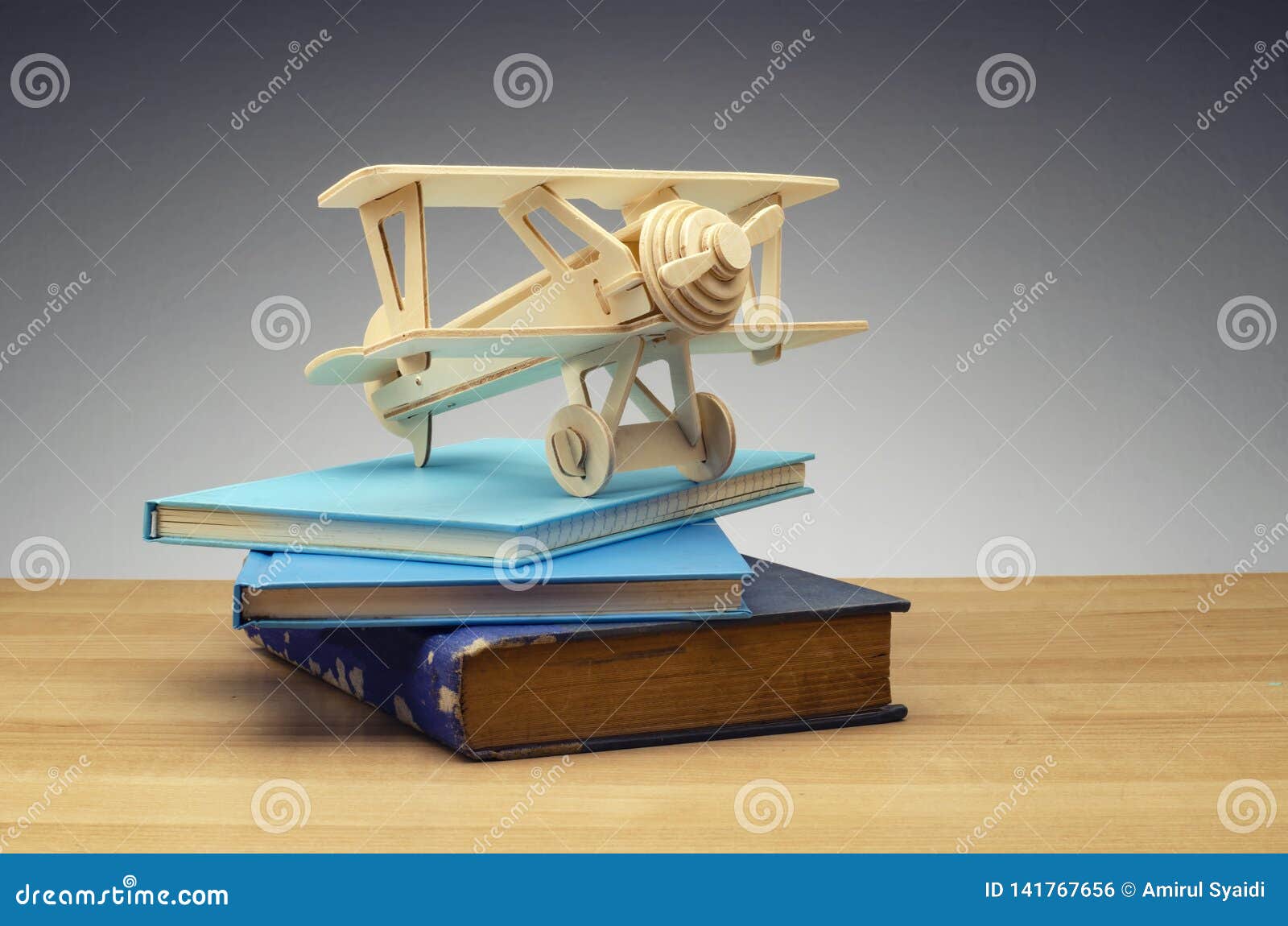 Retro Airplane on Stack of Book Over Dark Background Stock Photo ...