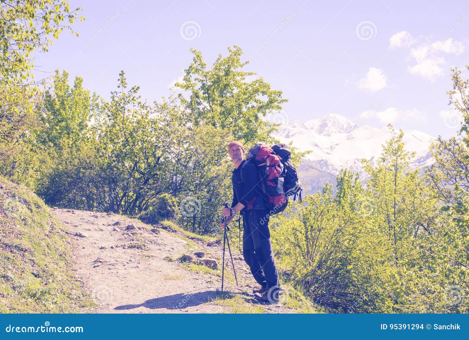 Traveler with Big Backpack Resting during a Difficult Climb Stock Photo ...