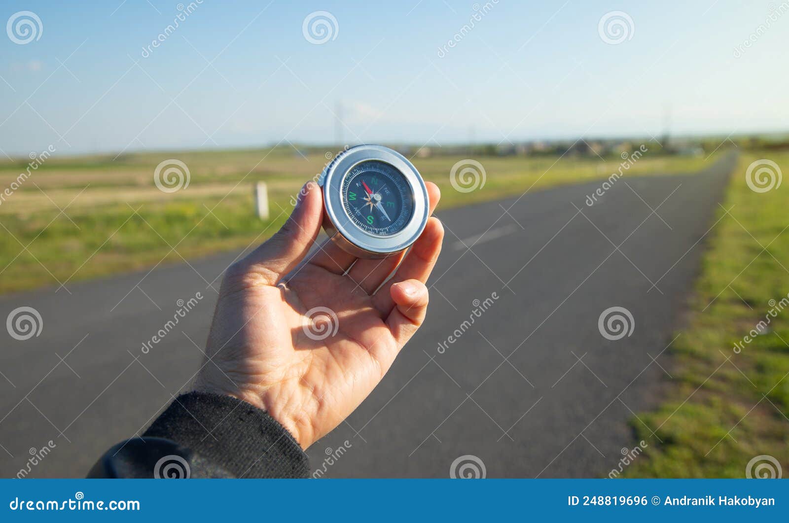 Traveler Holding Compass in Road Background Stock Photo - Image of path ...