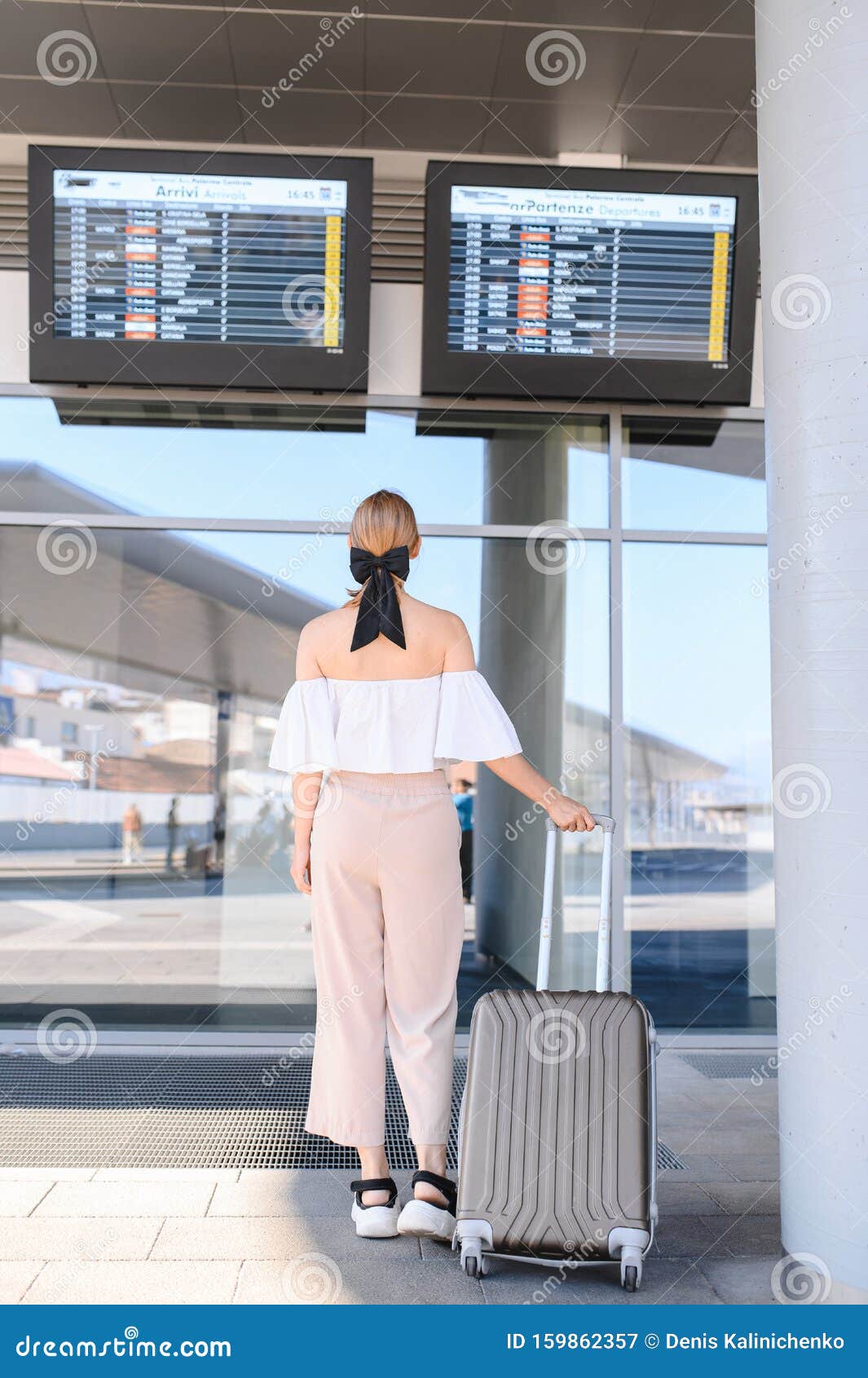 Traveler Looks at the Train Arrival Sign Stock Image - Image of ...