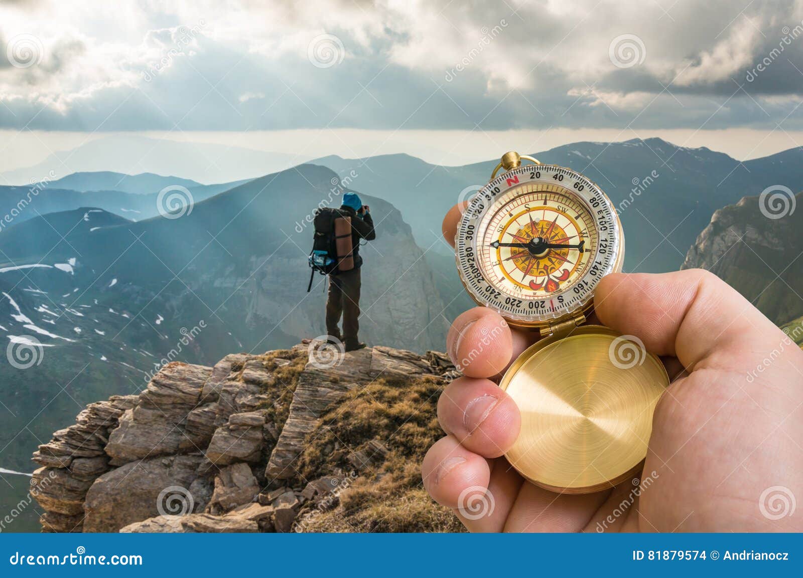 Traveler Man with Compass Seeking a Right Way in the Mountains Stock ...