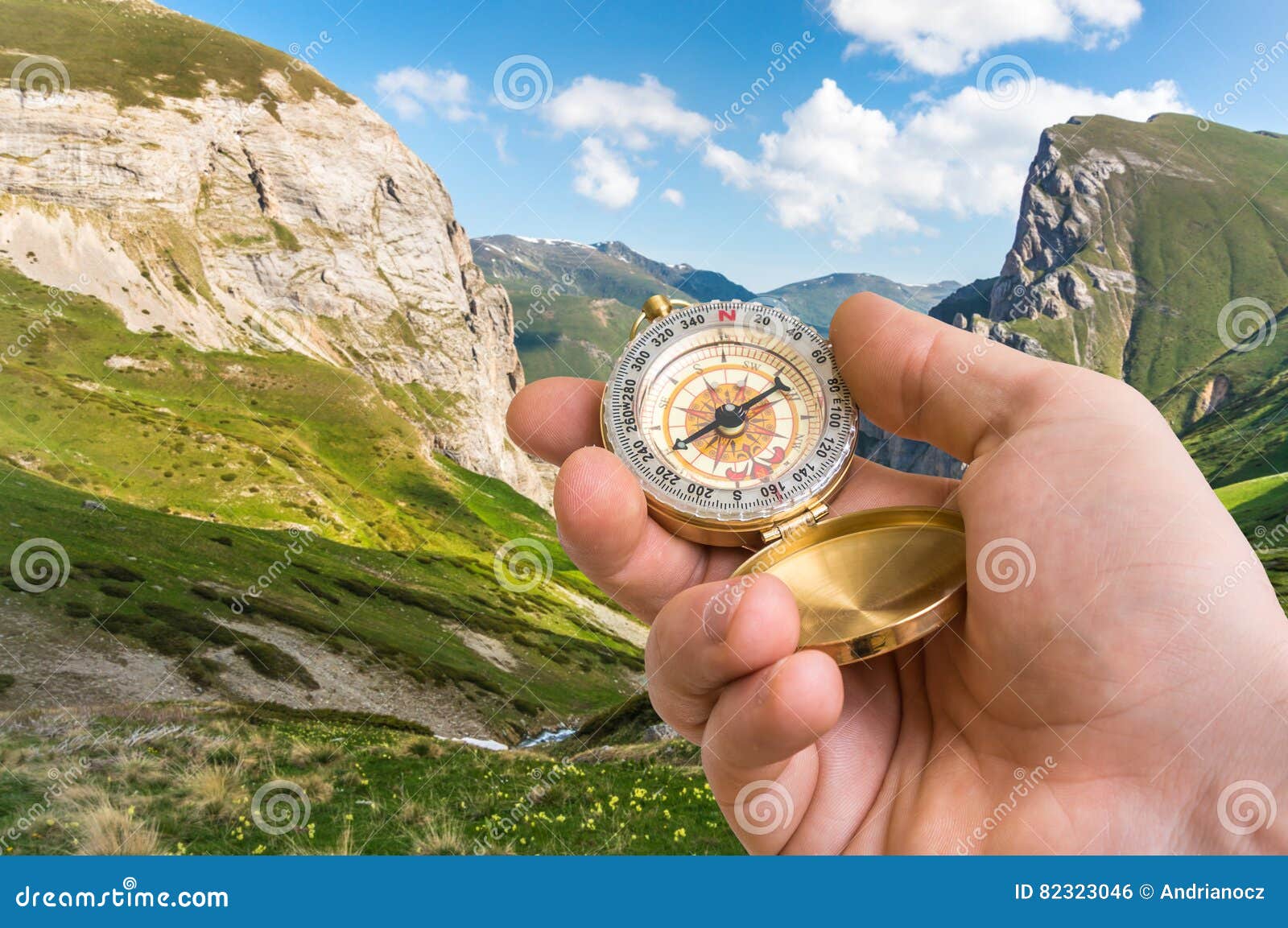 Traveler Man with Compass Seeking a Right Way in the Mountains Stock ...