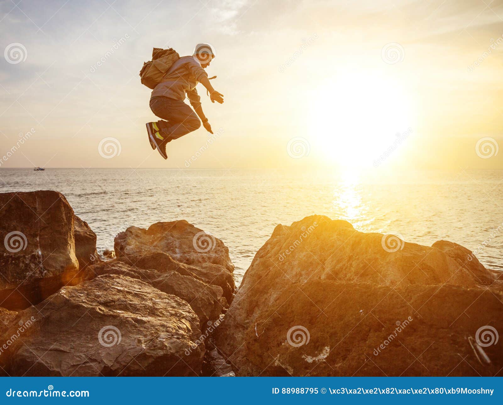 Traveler Man Jumping Over Rocks Stock Image - Image of nature, climbing ...