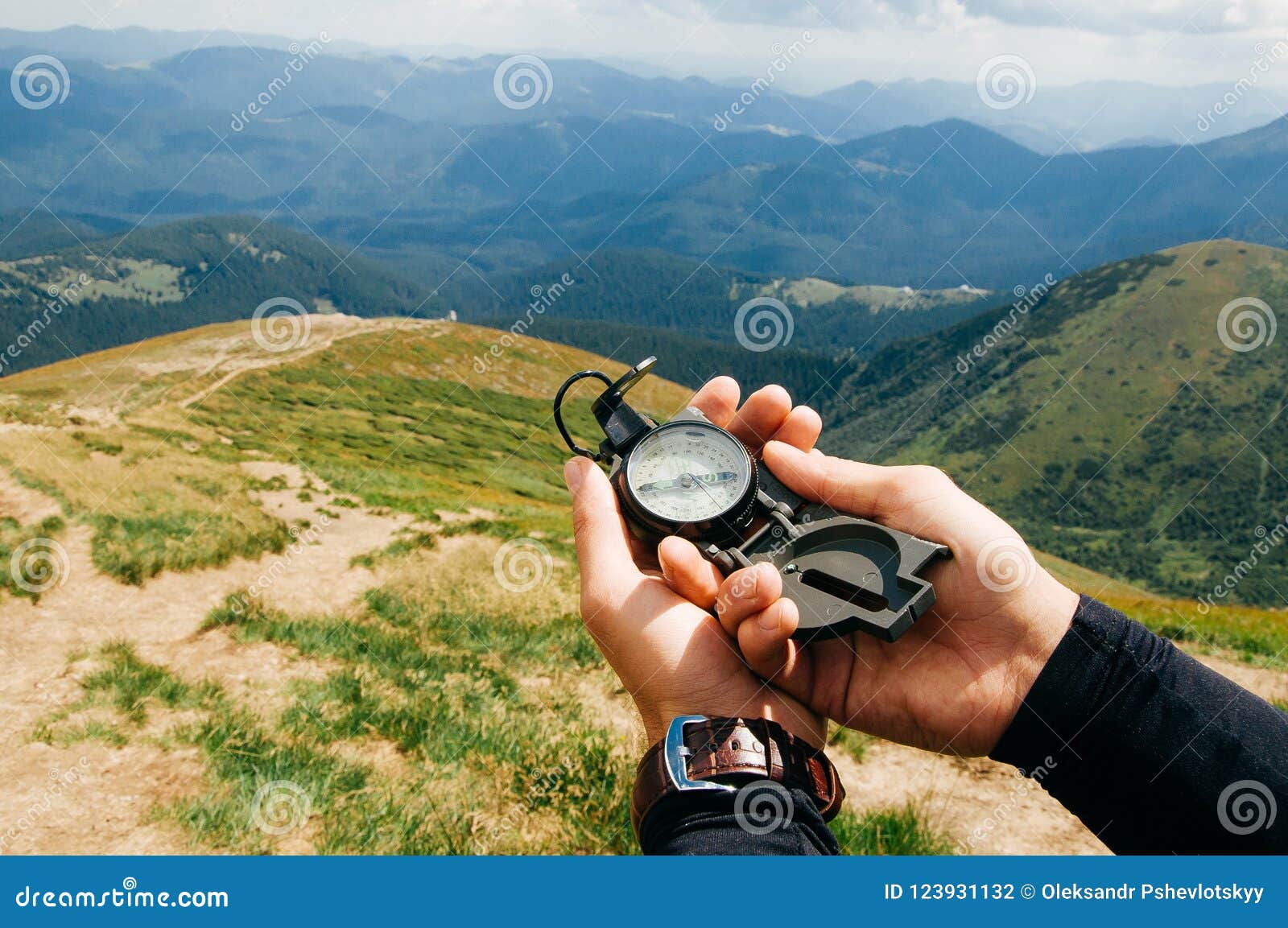 A Traveler in the Mountains with a Compass Stock Photo - Image of ...