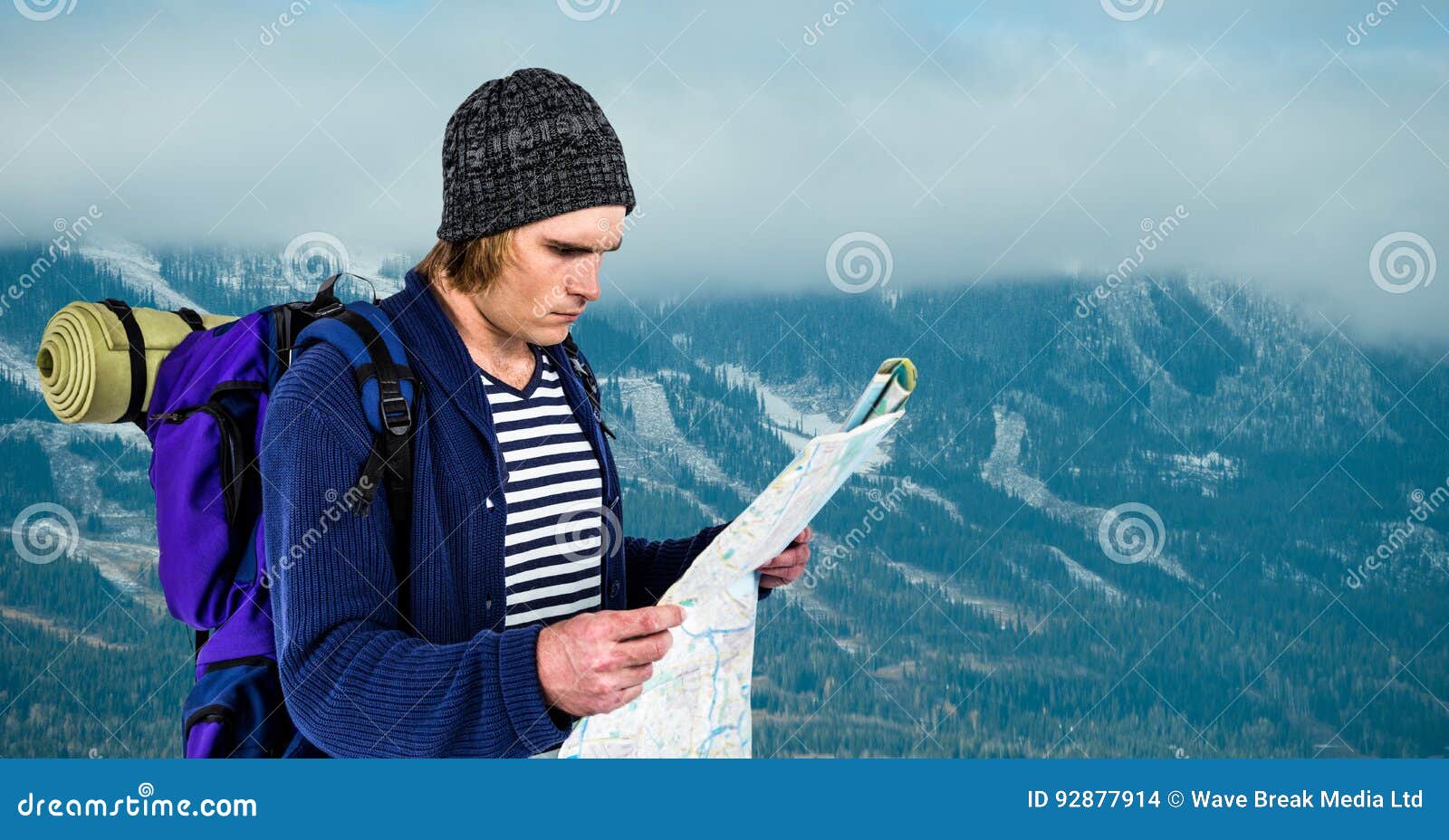 Traveler Reading Map while Carrying Backpack on Mountain Stock Photo ...