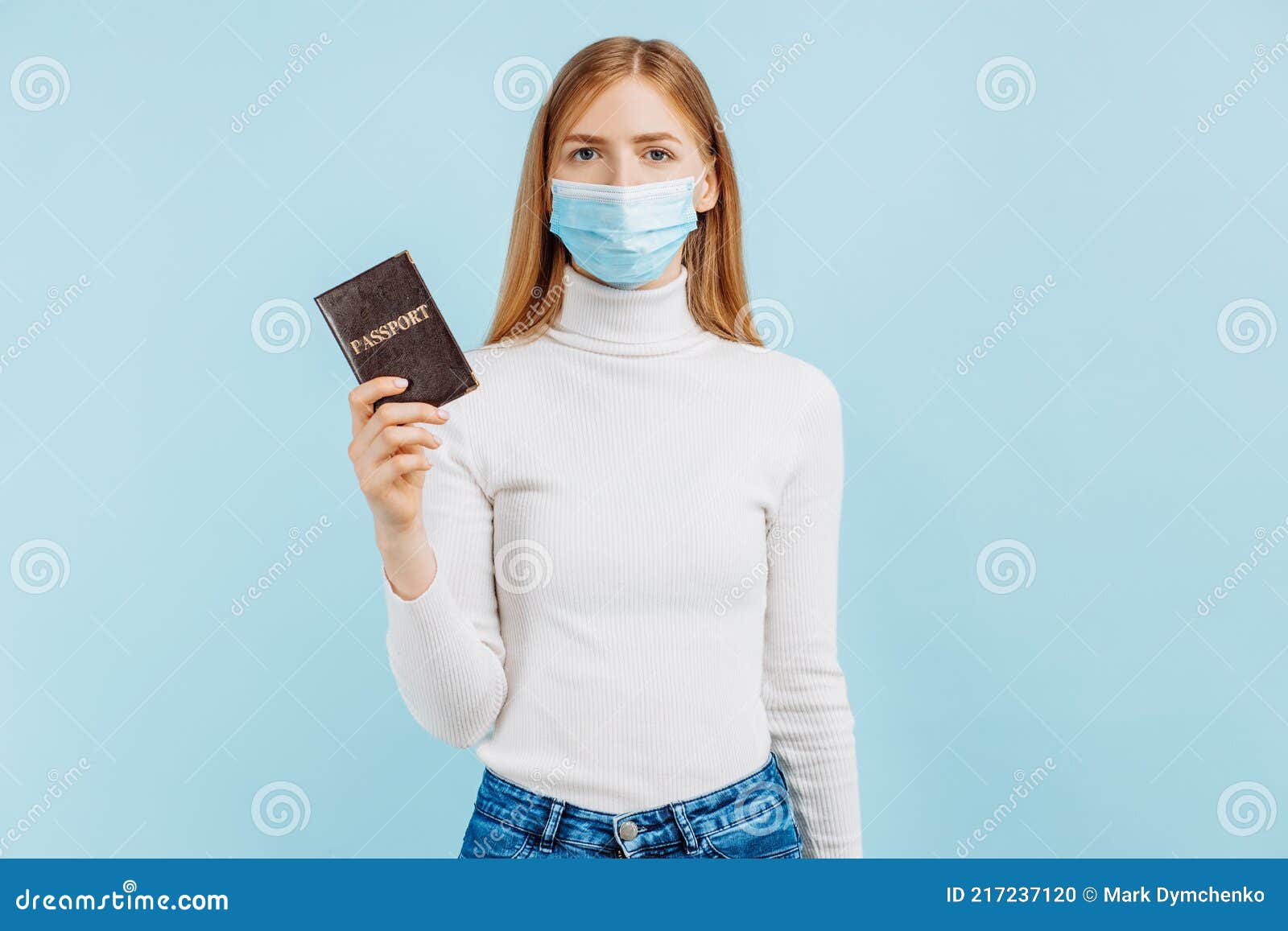 Traveler Tourist Woman In A Medical Mask On Her Face With A Passport