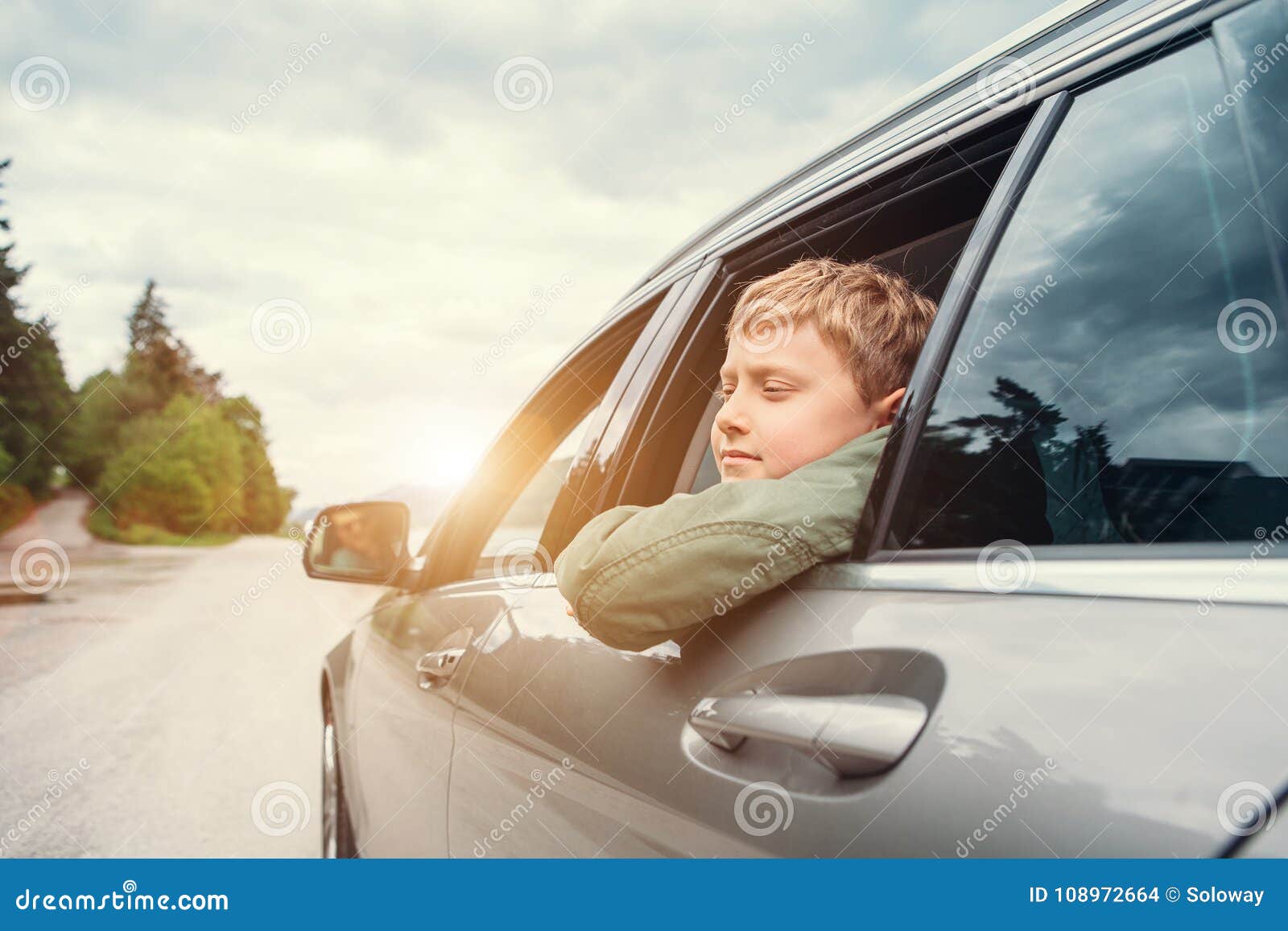 Traveling by Auto - Son and Father Look Out from Car Windows Stock ...