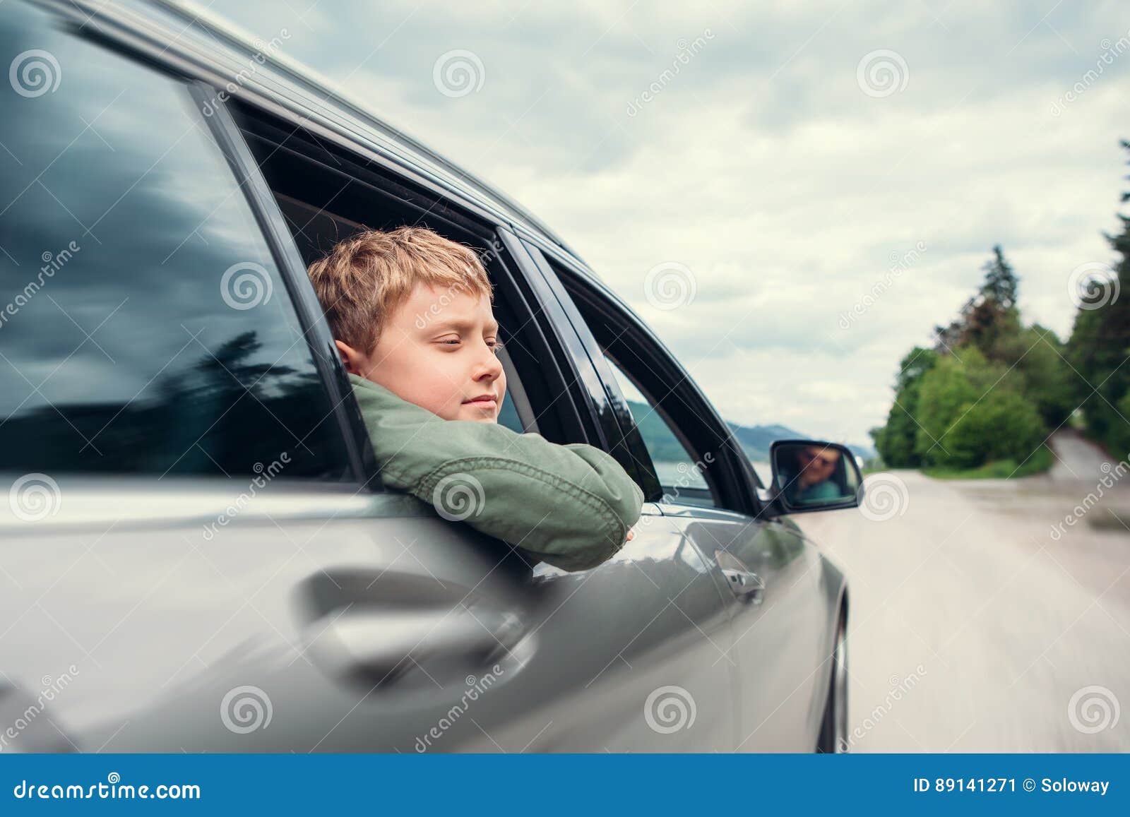 Traveling by Auto - Son and Father Look Out from Car Windows Stock ...