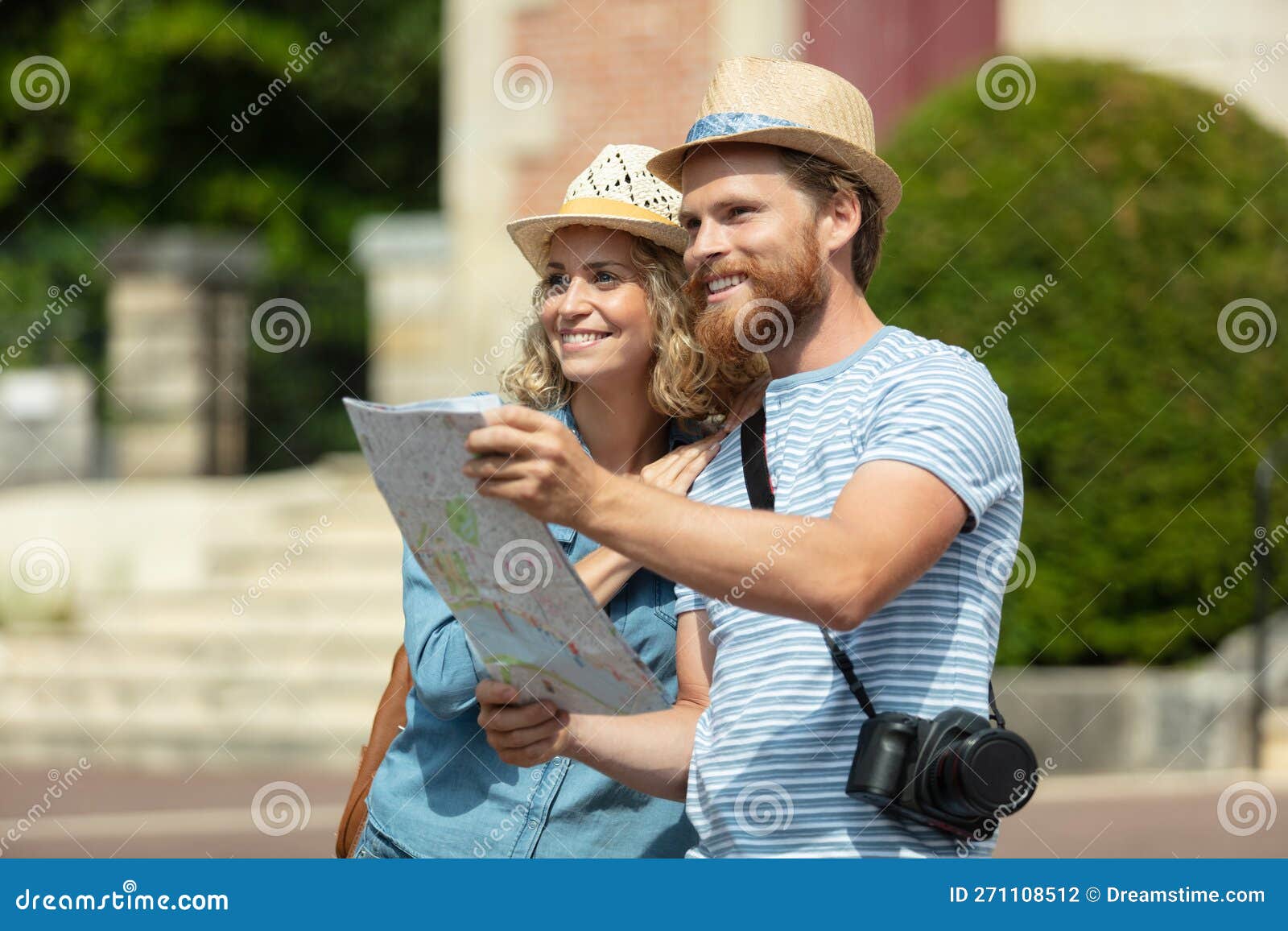 Traveling Couple Searching for Their Next Destination on Map Stock ...
