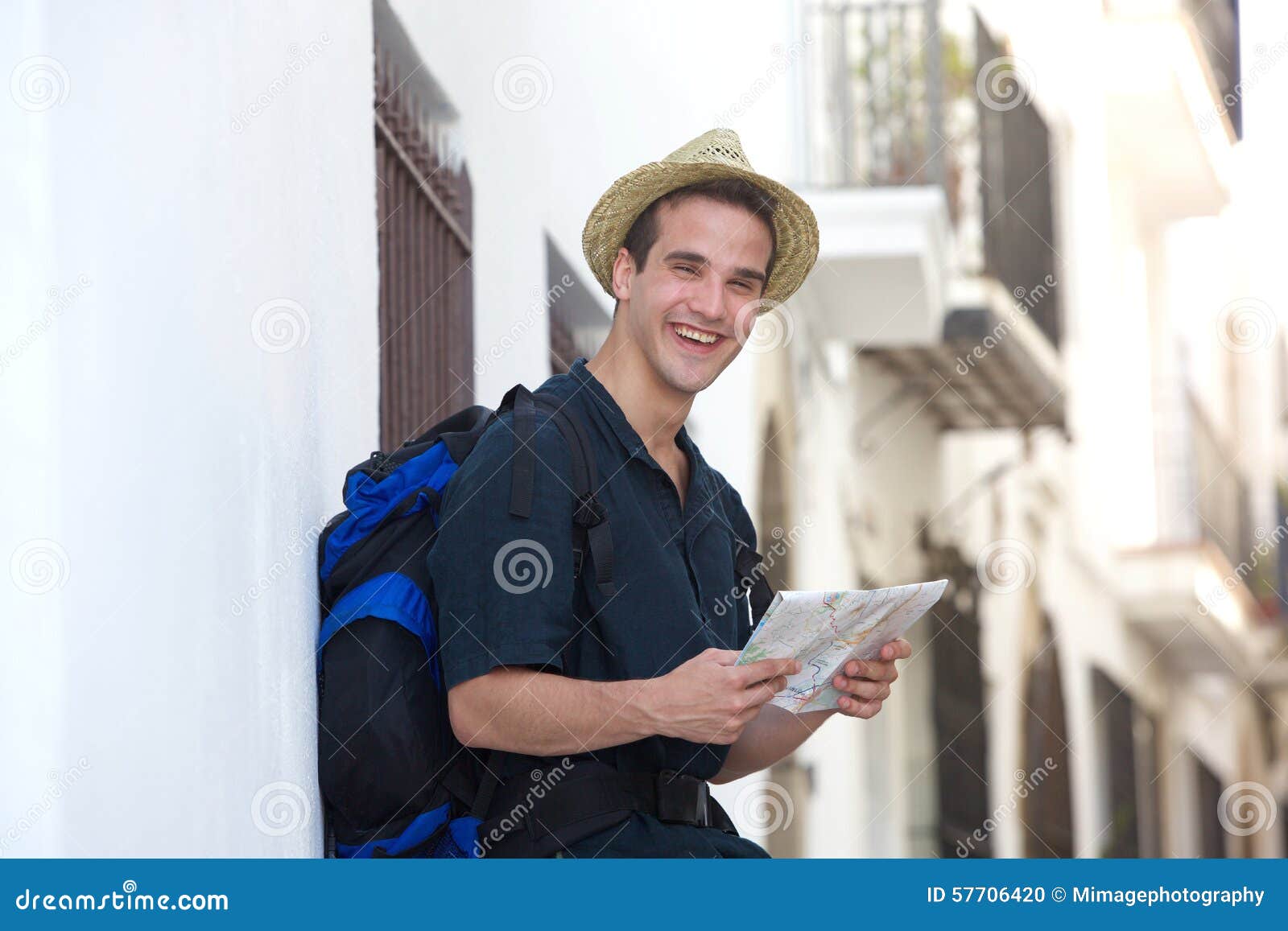 Traveling Man Laughing Outside with Map Stock Photo - Image of holiday ...