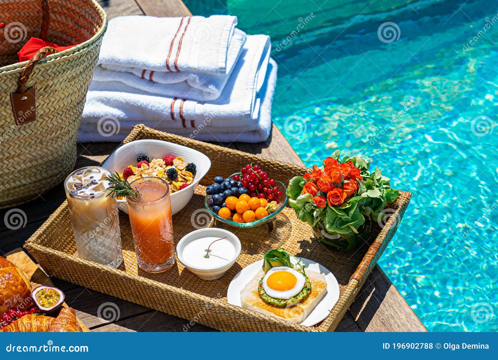 Tray with Assorted Breakfast Meal and Drinks Near Swimming Pool Stock ...