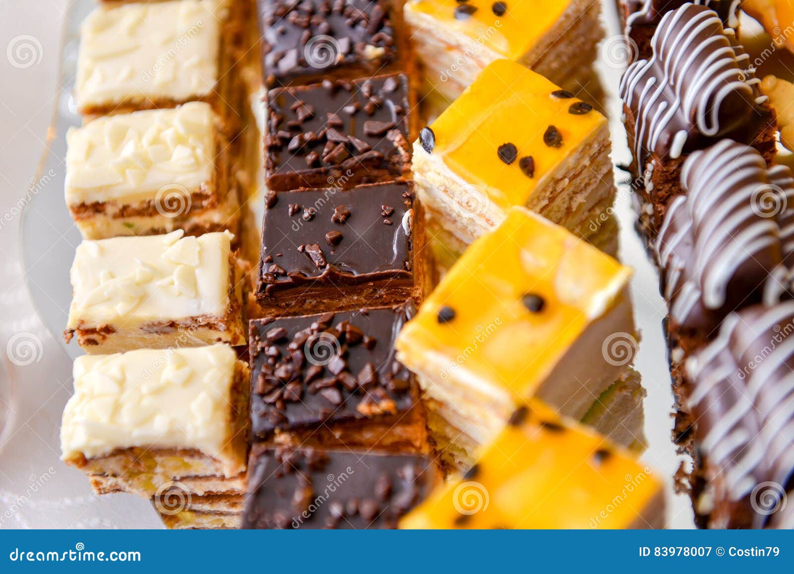 Tray with assorted cakes stock image. Image of colorful - 83978007