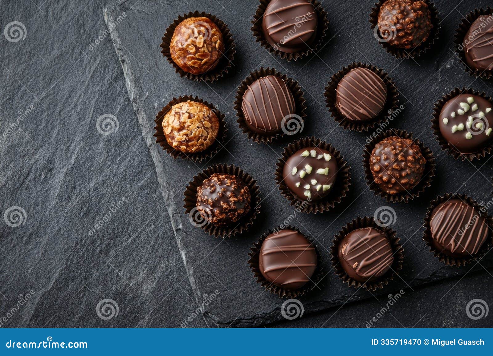 A Tray of Assorted Chocolates with a Black Background Stock ...
