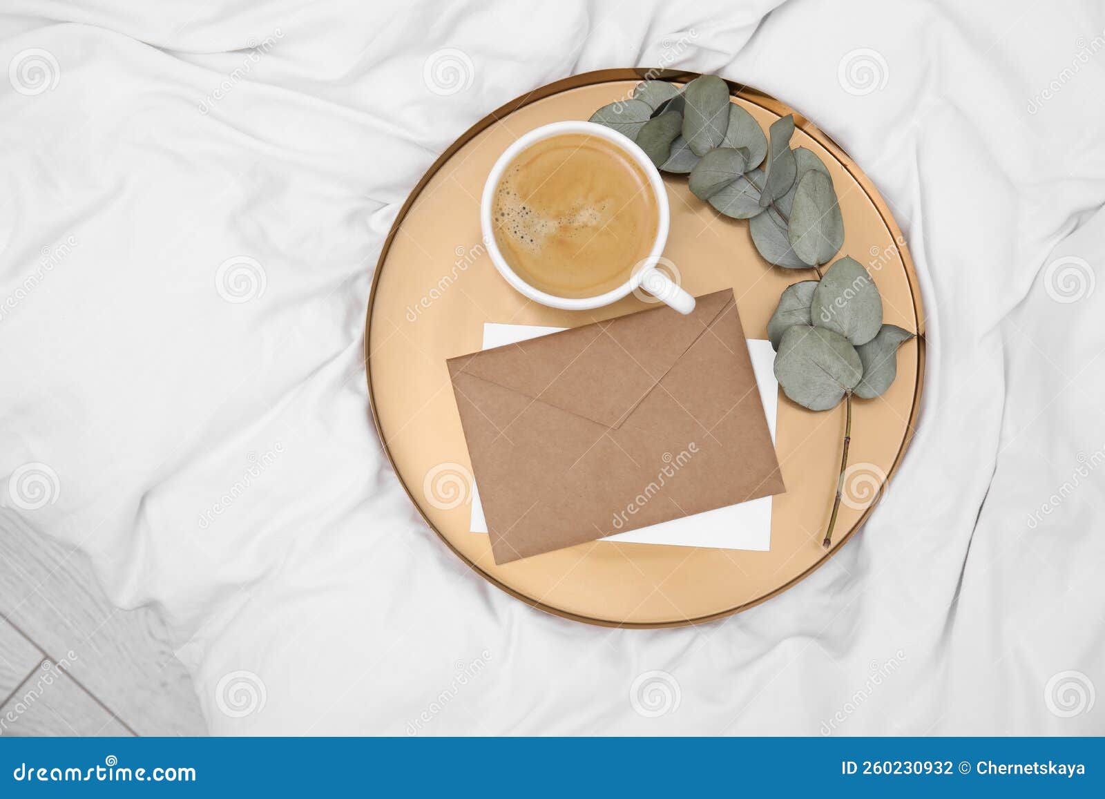 Tray with Cup of Coffee, Envelope and Eucalyptus Branch on White Bed ...