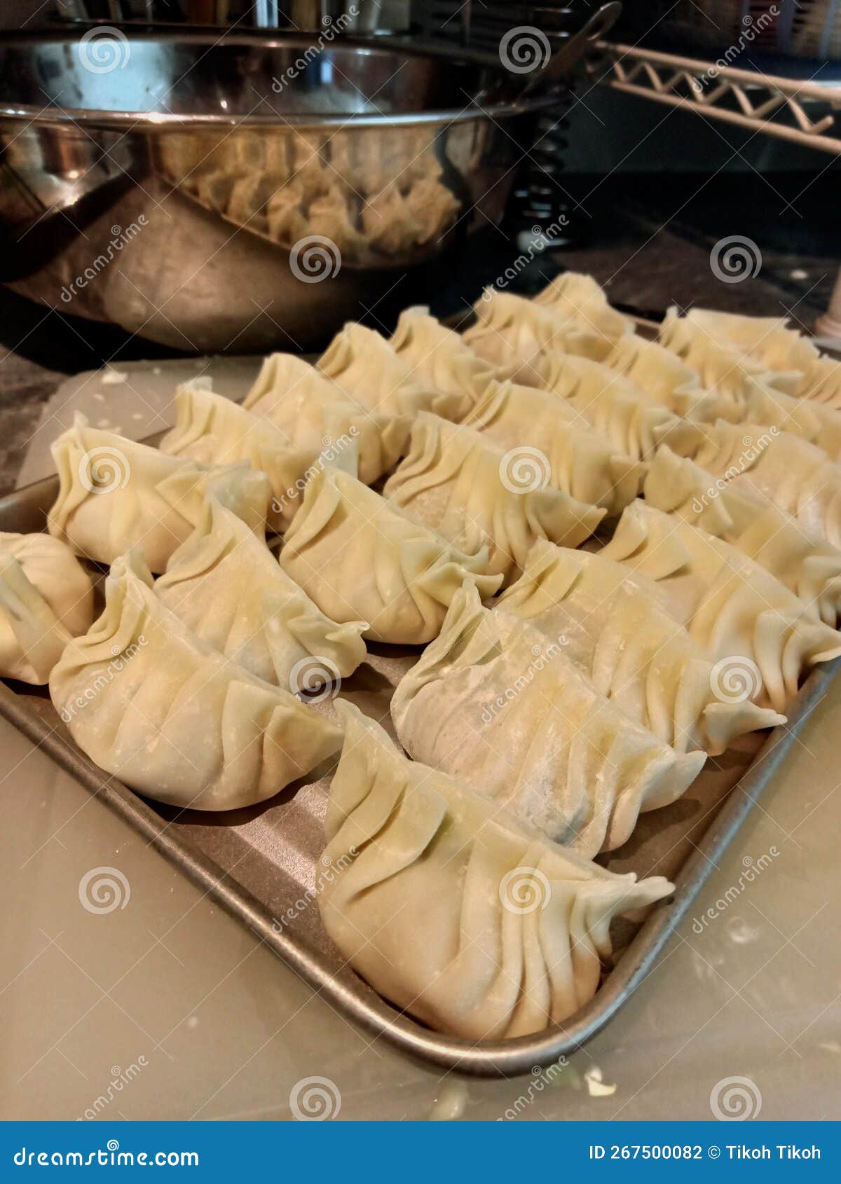 A Tray of Dumplings Filled with Chicken Photos Stock Photo - Image of ...