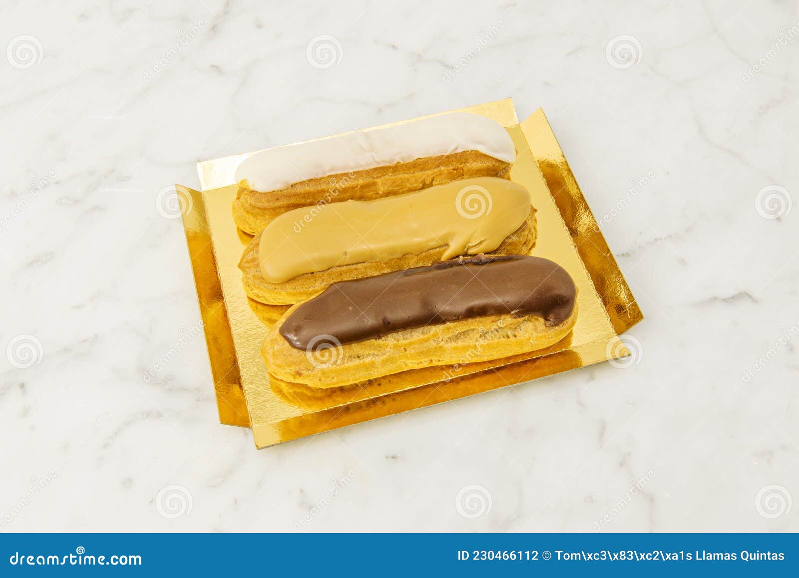Tray of Eclairs with Topping of Three Different Chocolates Stock Photo ...