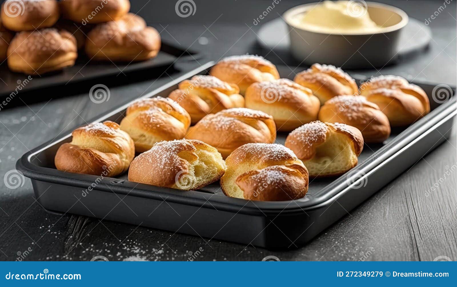 A Tray Filled with Rolls and Butter on Top of a Table Stock ...