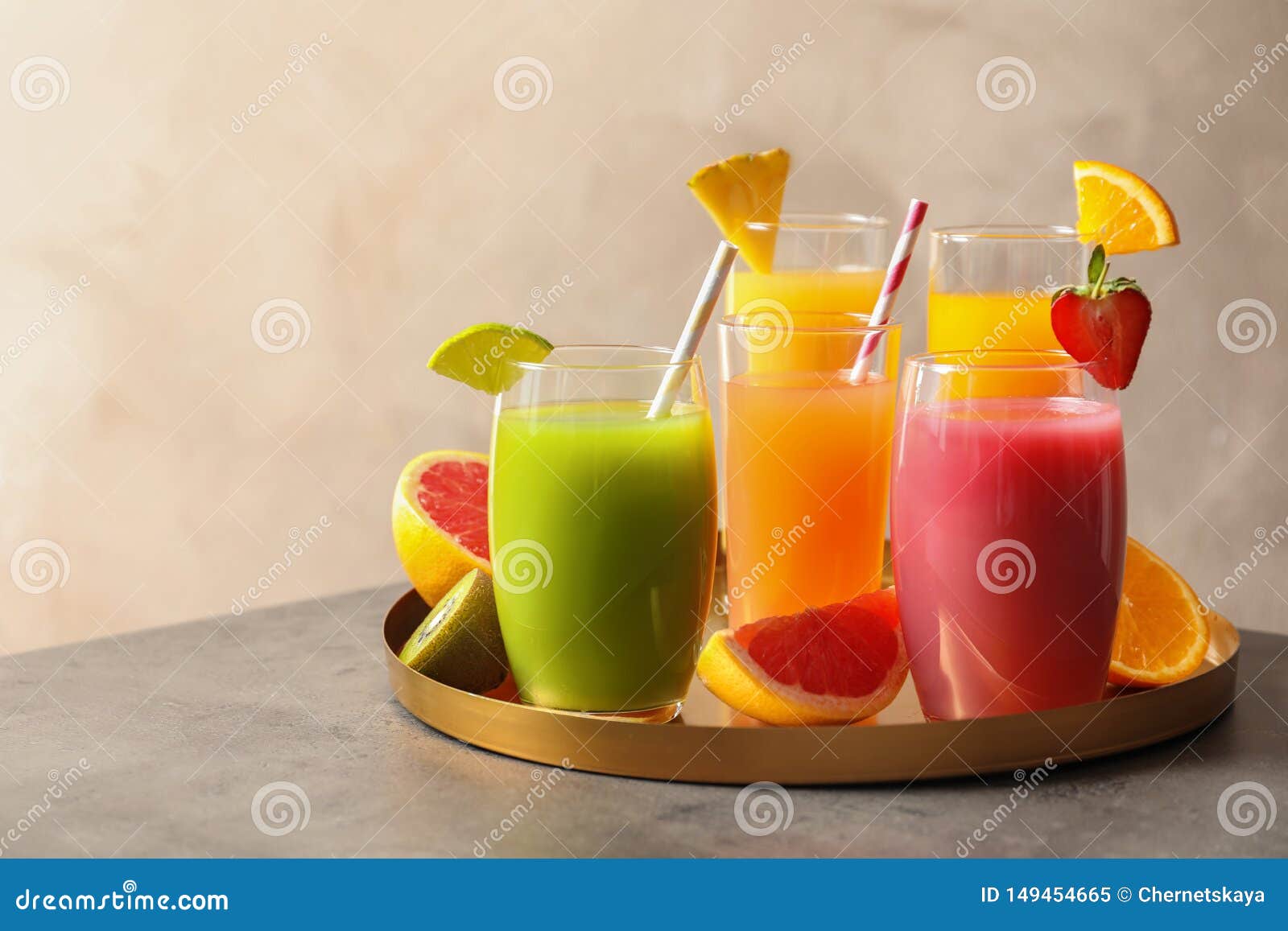 Tray with Glasses of Different Juices and Fresh Fruits on Table Stock ...