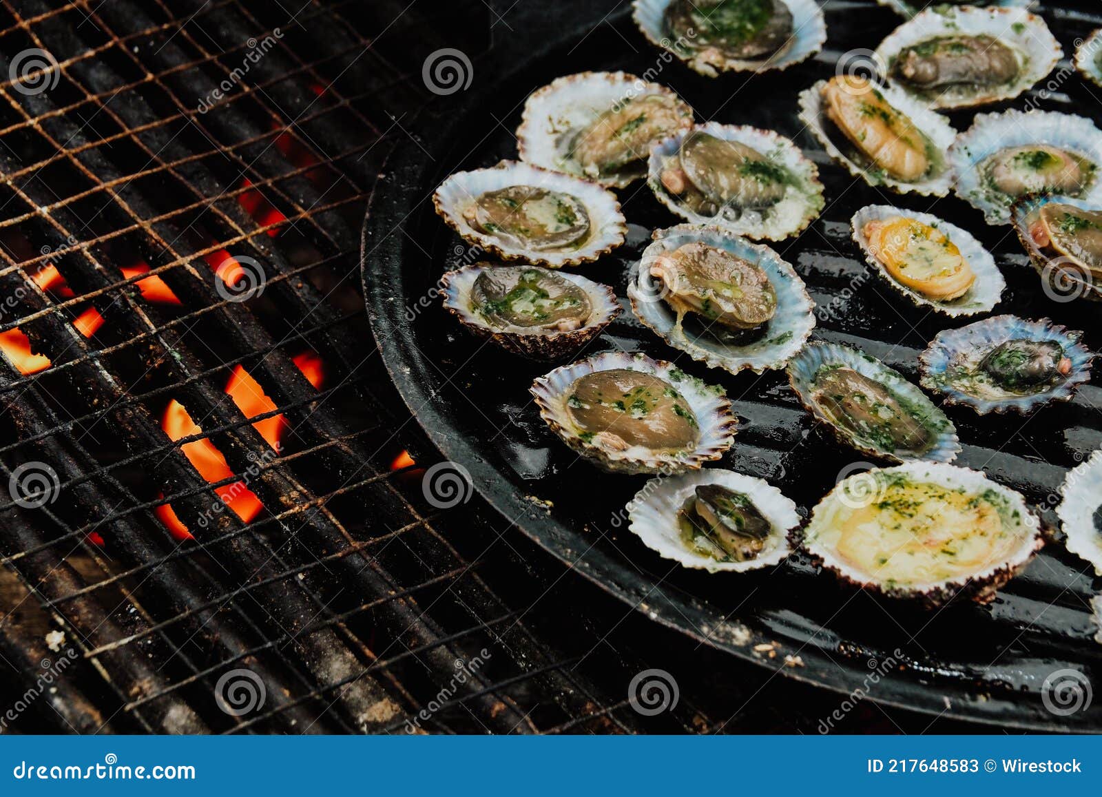 Tray with lapas on a grill stock image. Image of delicious - 217648583