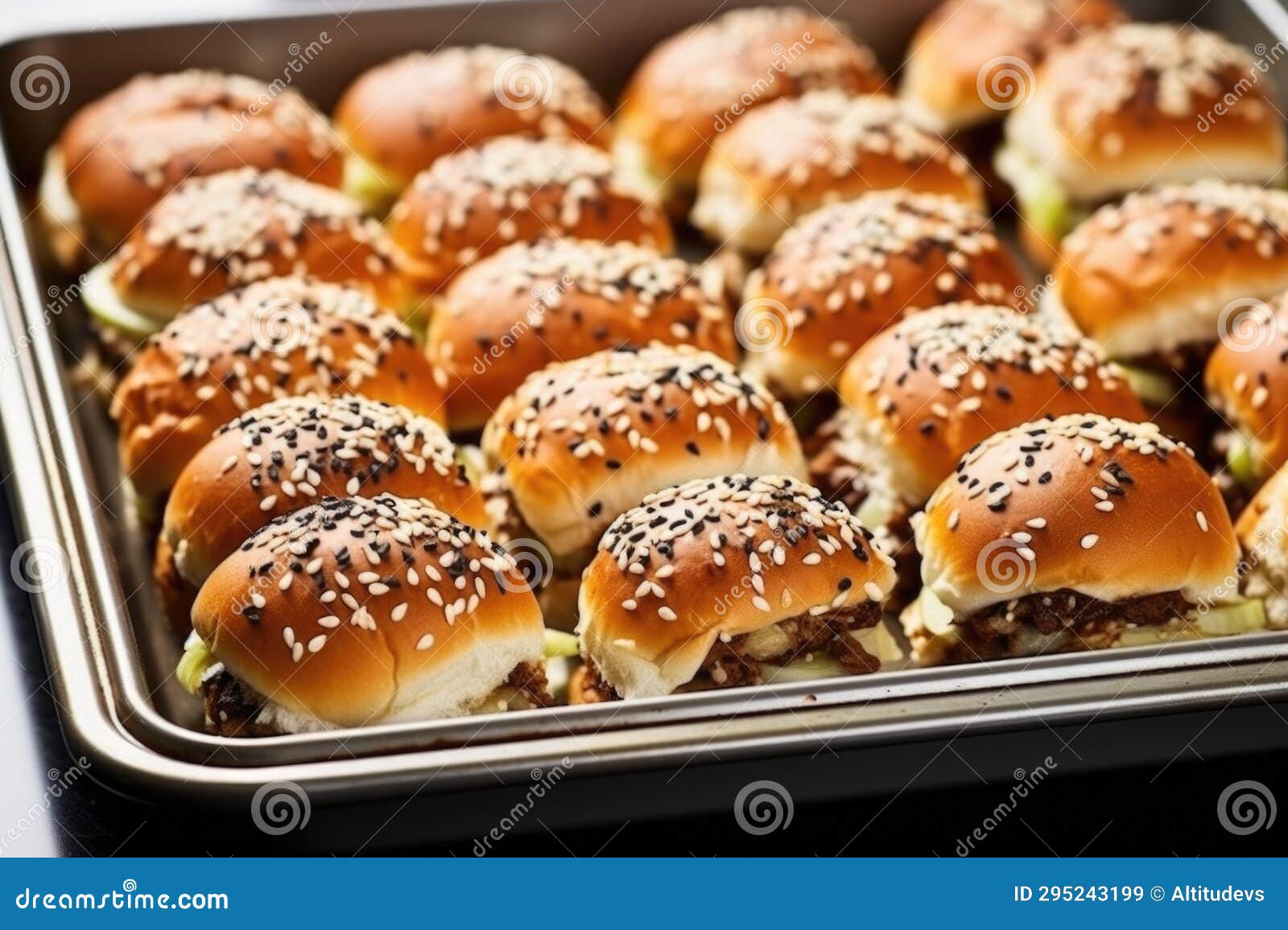 A Tray of Mixed Bbq Sliders with Sesame Seeds Topping Stock Image ...