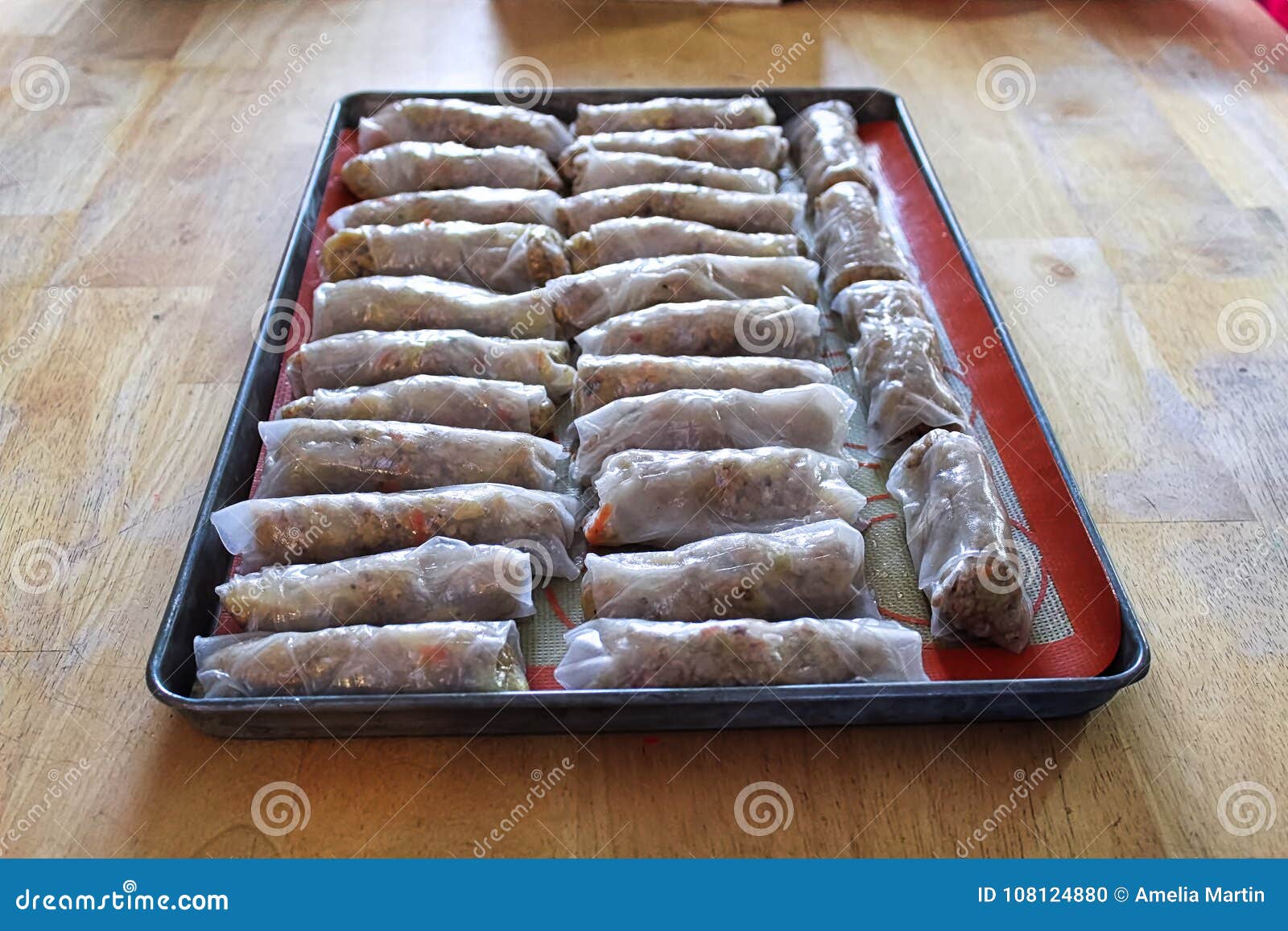 A Tray of Rice Wrapped Spring Rolls on a Cookie Sheet Stock Photo ...
