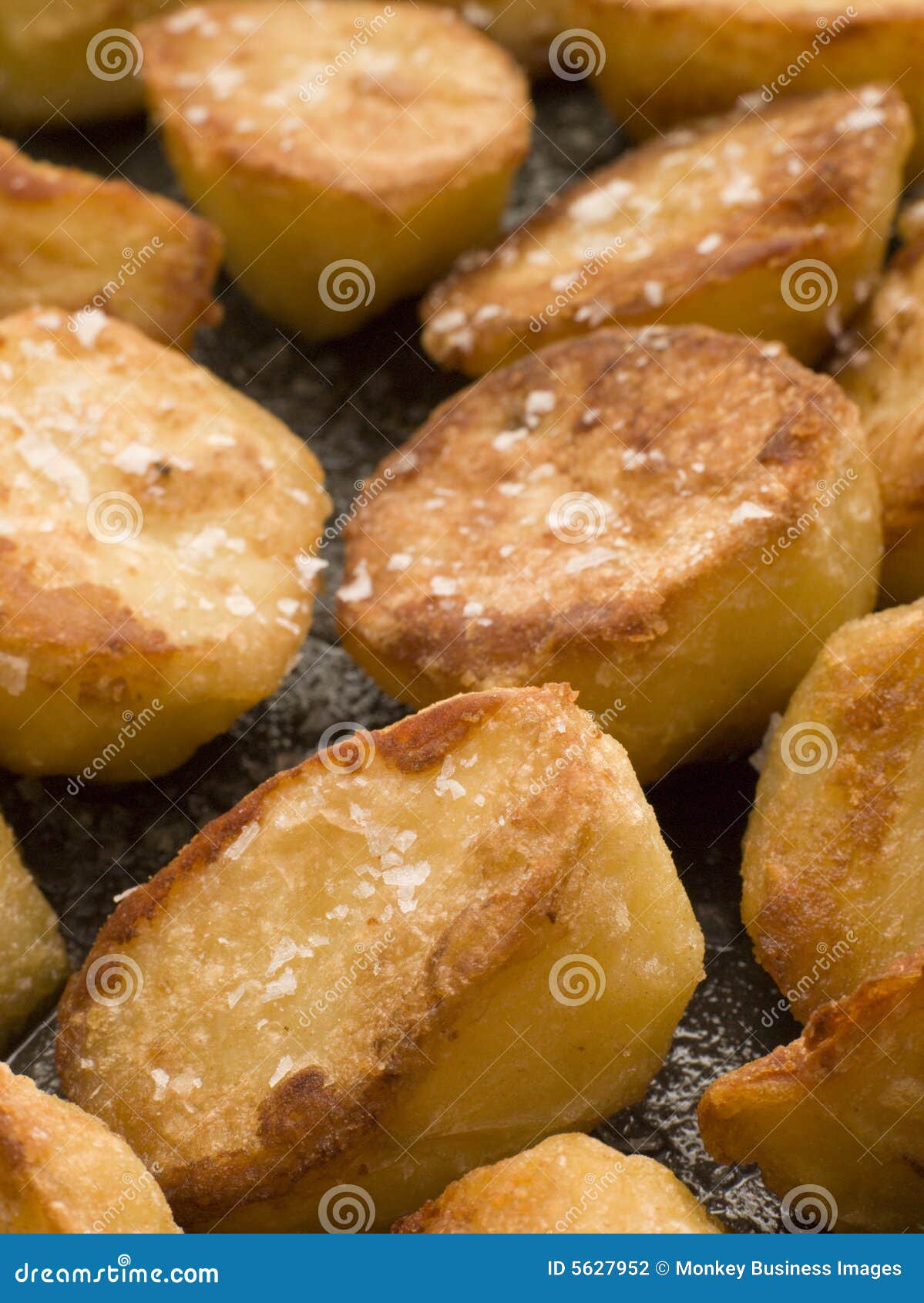 Tray of Roast Potatoes with Sea Salt Stock Photo - Image of maris ...