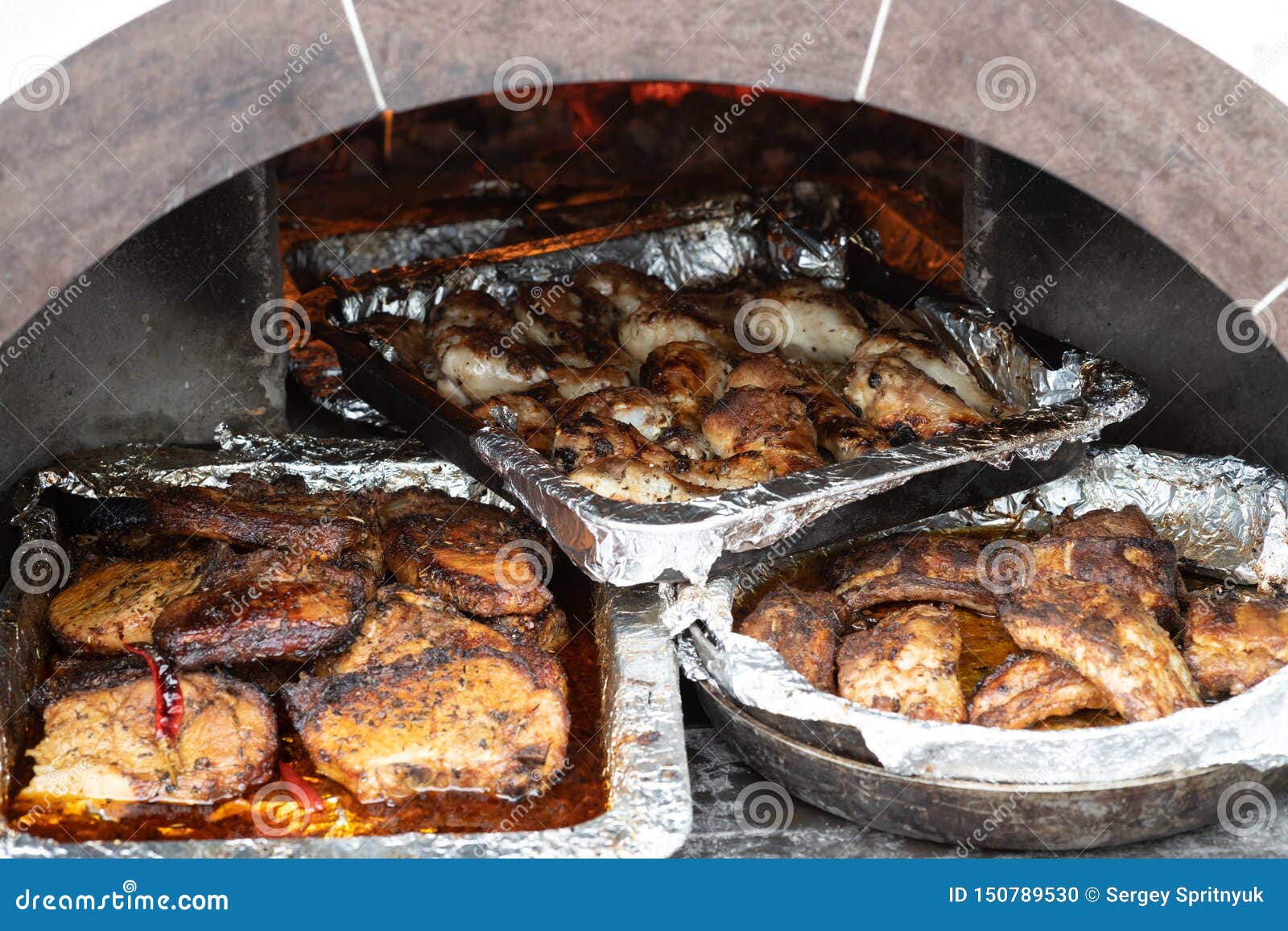 Trays of Cooked Meat in the Oven on the Coals Stock Photo - Image of ...