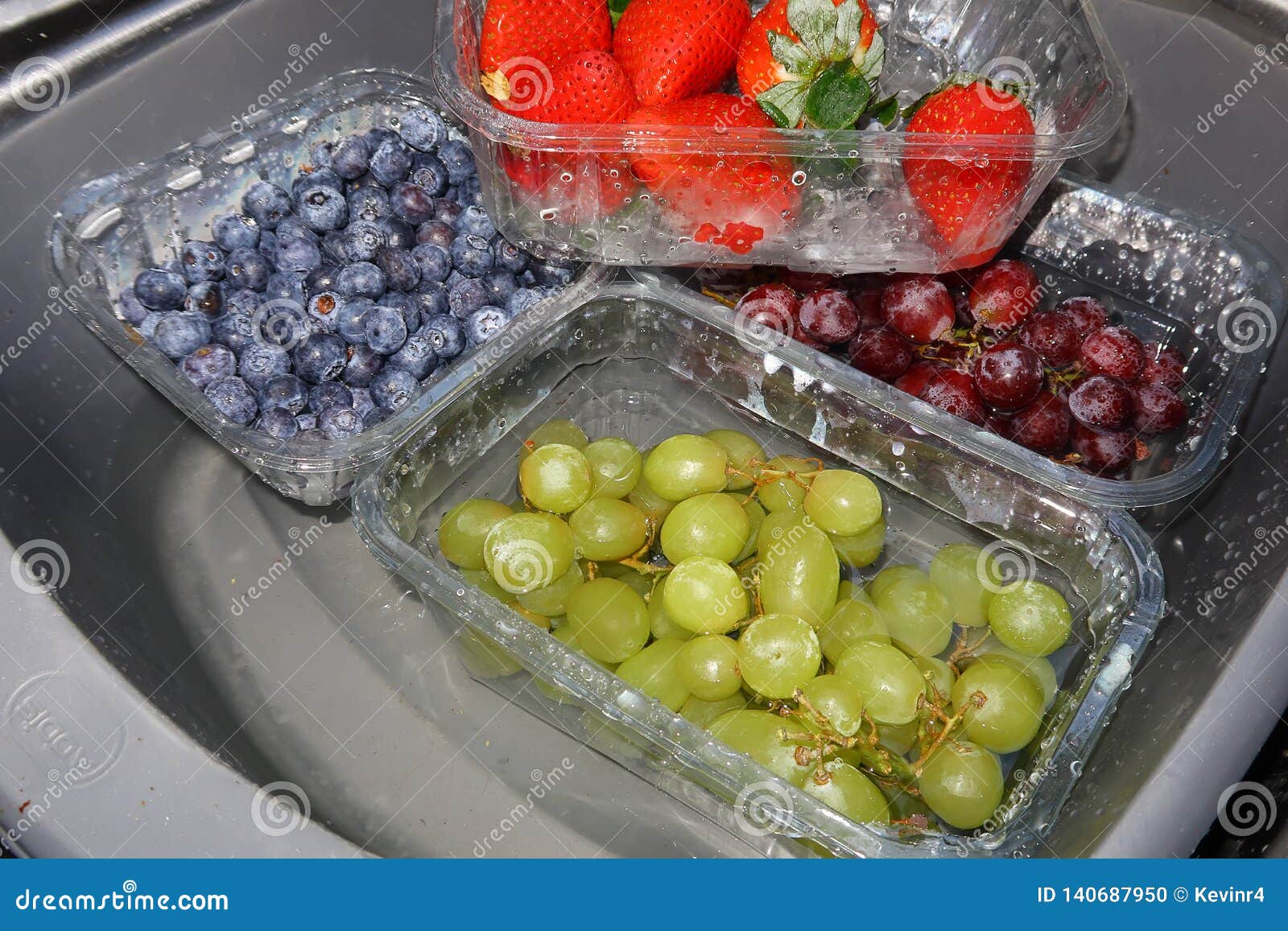 Trays of Fresh Fruit Being Washed Stock Photo - Image of strawberries ...