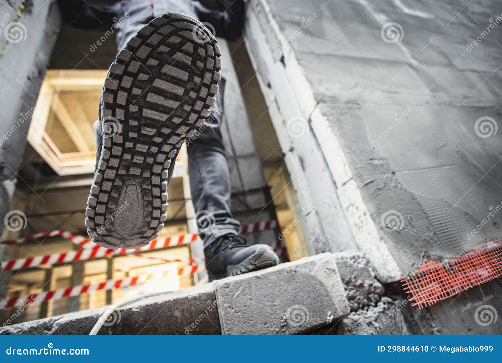 Tread Construction Safety Shoes on a Worker Walking on a Construction ...