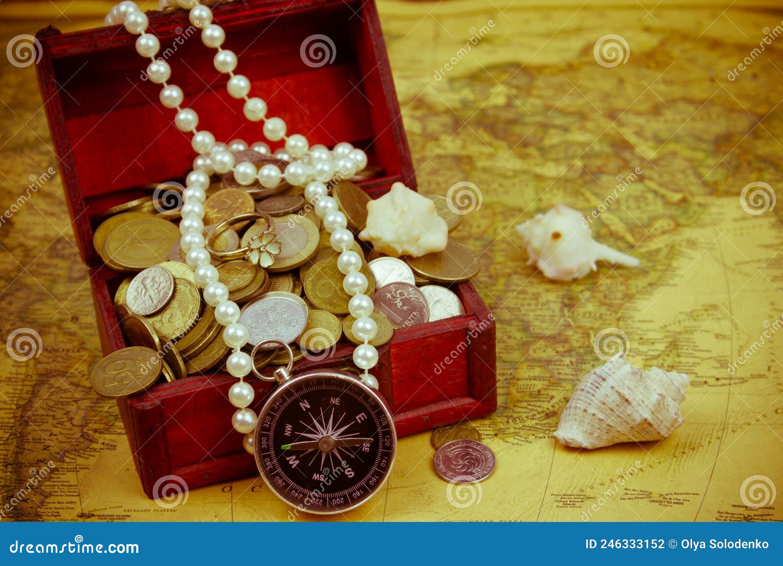 Treasure Chest with Jewelry and Coins, Compass and Shells on a Vintage ...