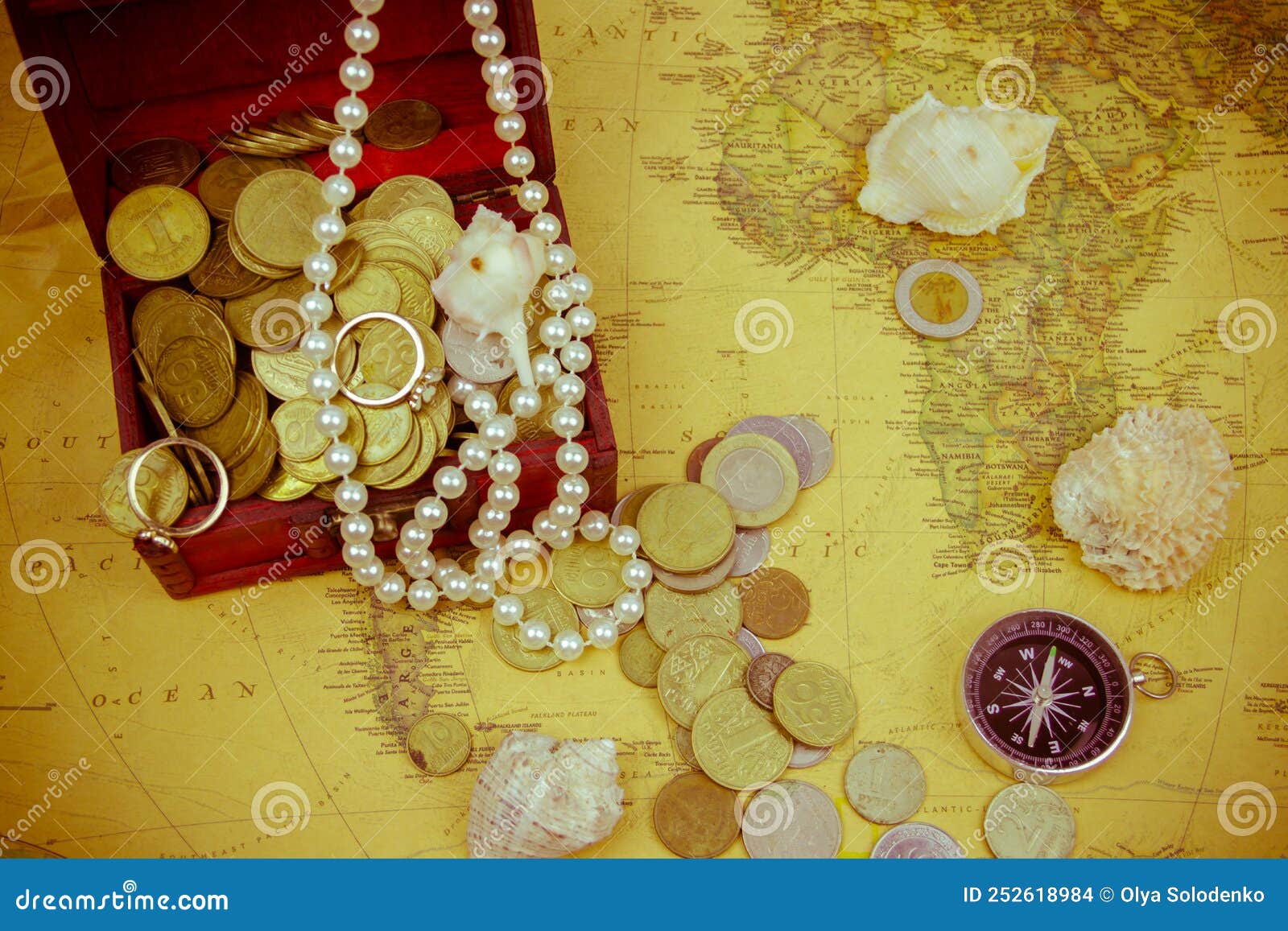 Treasure Chest with Jewelry and Coins, Compass and Shells on a Vintage ...