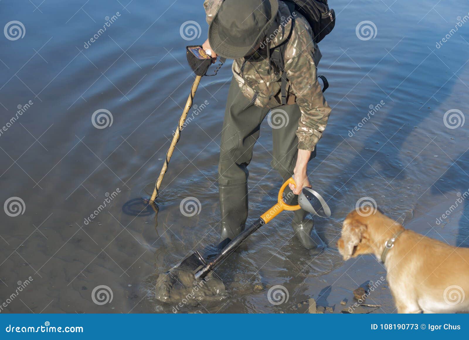 Treasure Hunter is Looking for a Metal Detector in the River Stock ...