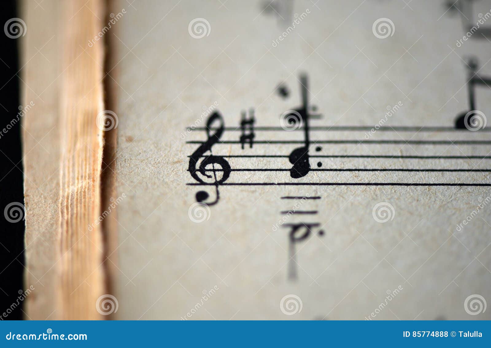 Treble Clef and Musical Notes in the Old Musical Notebook Stock Photo ...