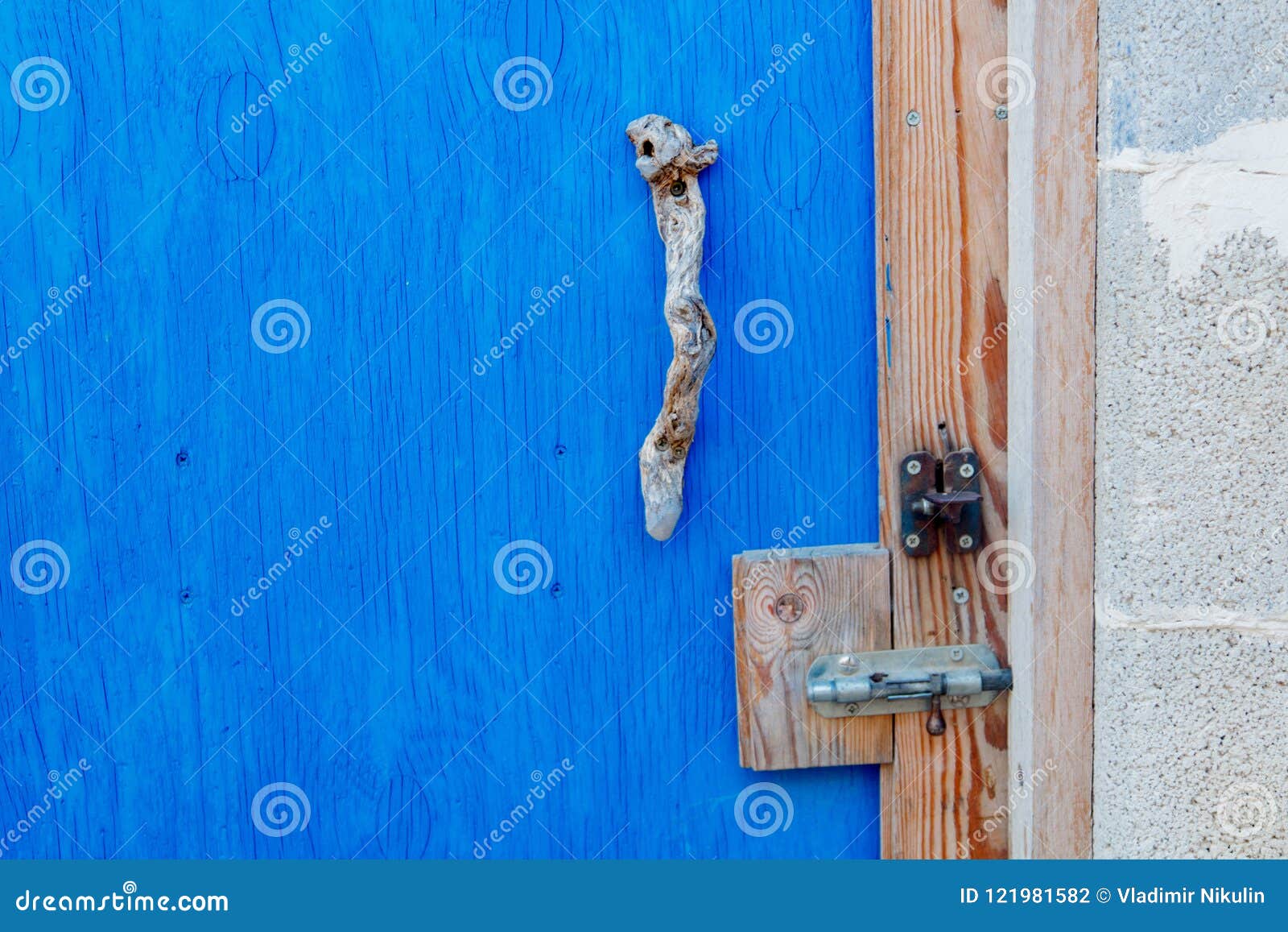 Tree Branch Door Knob on Blue Door, Stock Photo - Image of branch ...