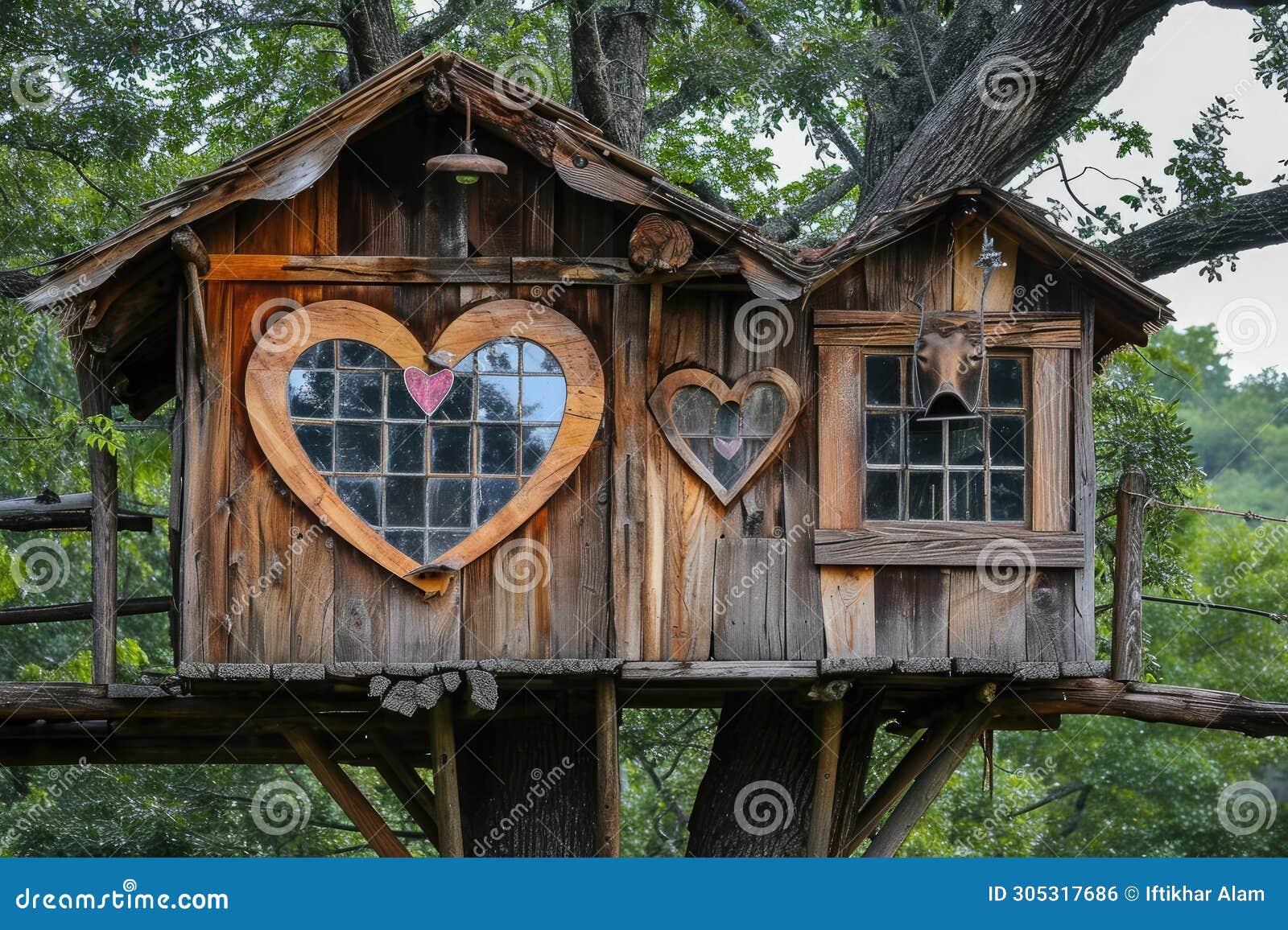 A Tree House Built in the Shape of a House, Featuring Two Heart Shaped ...