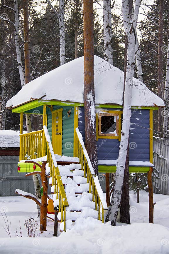Tree house under the snow stock photo. Image of play - 64732602