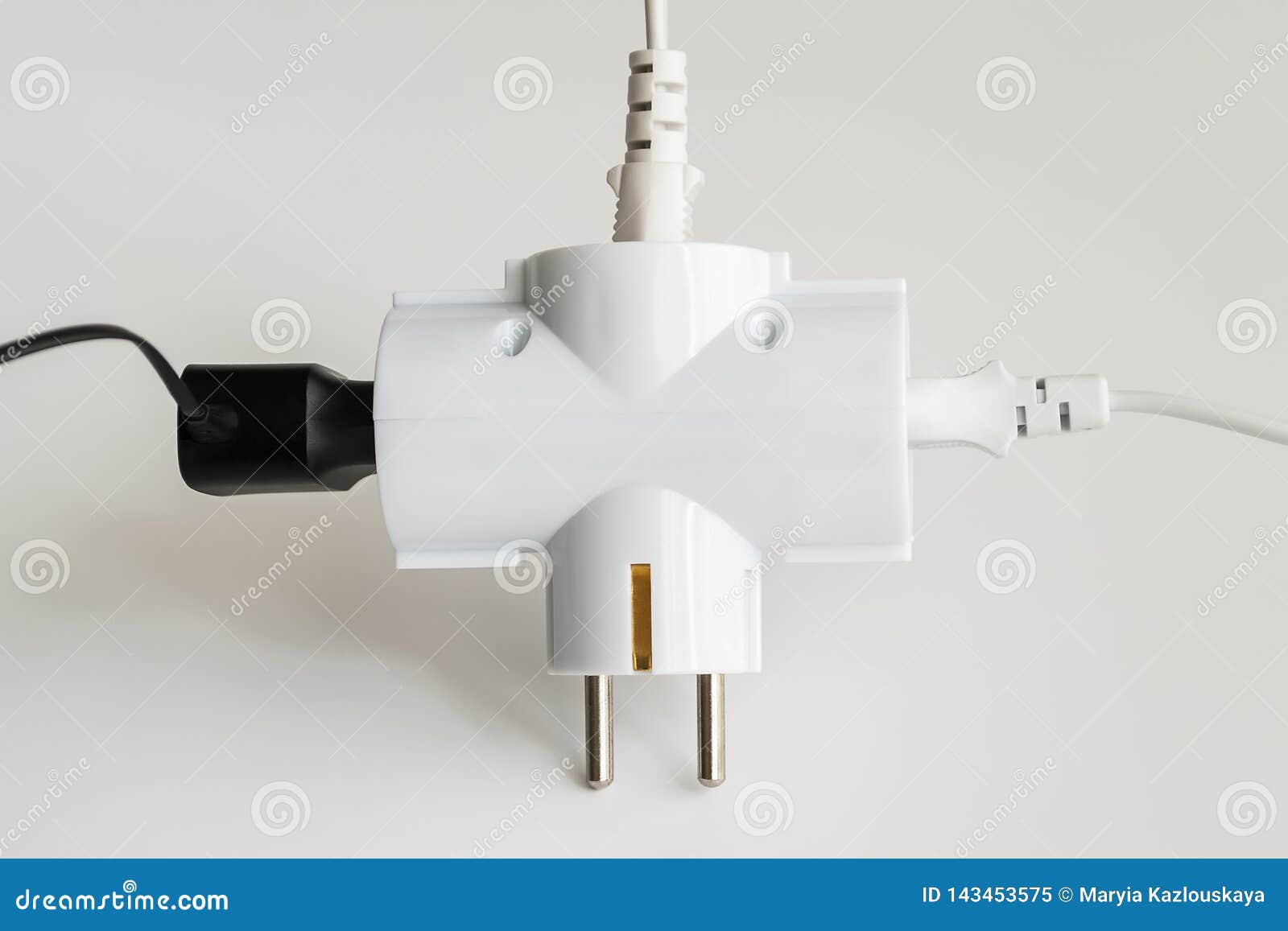 Tree Plugs Socketed into White Electric Splitter on a White Background ... Tree Plugs Socketed into White Electric Splitter on a White Background ...