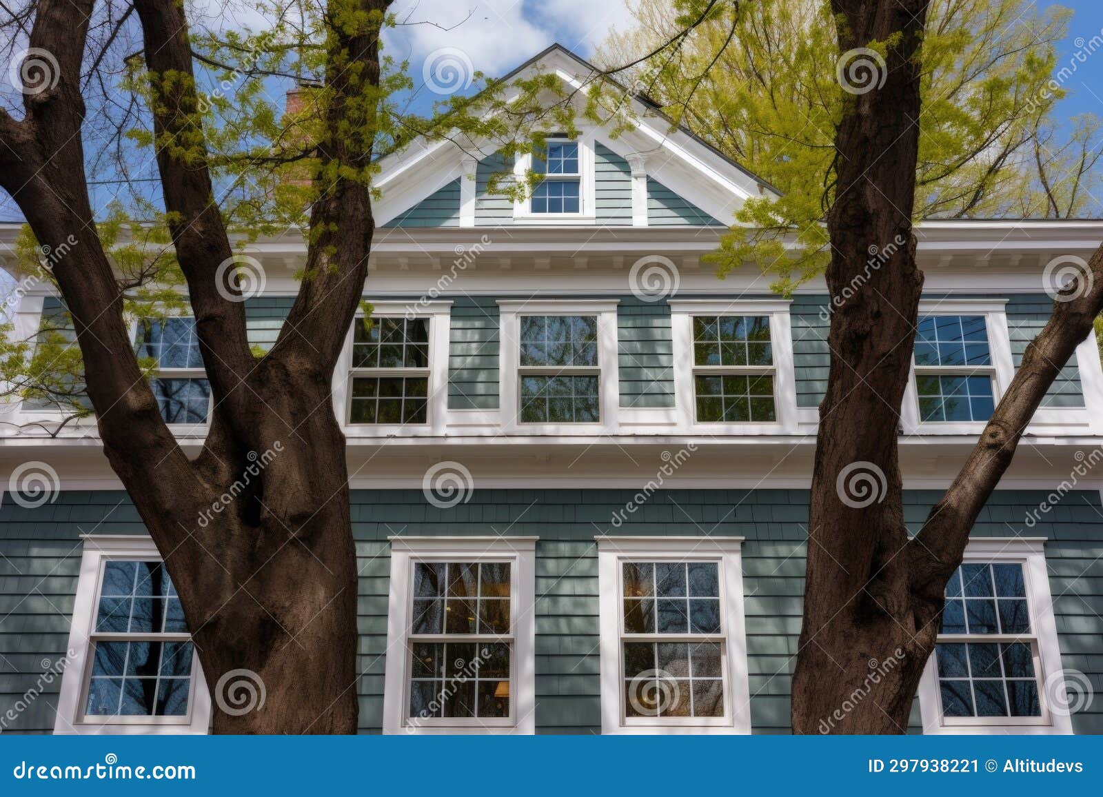 Tree Reflection on the Dormer Windows of a Colonial Revival House Stock ...
