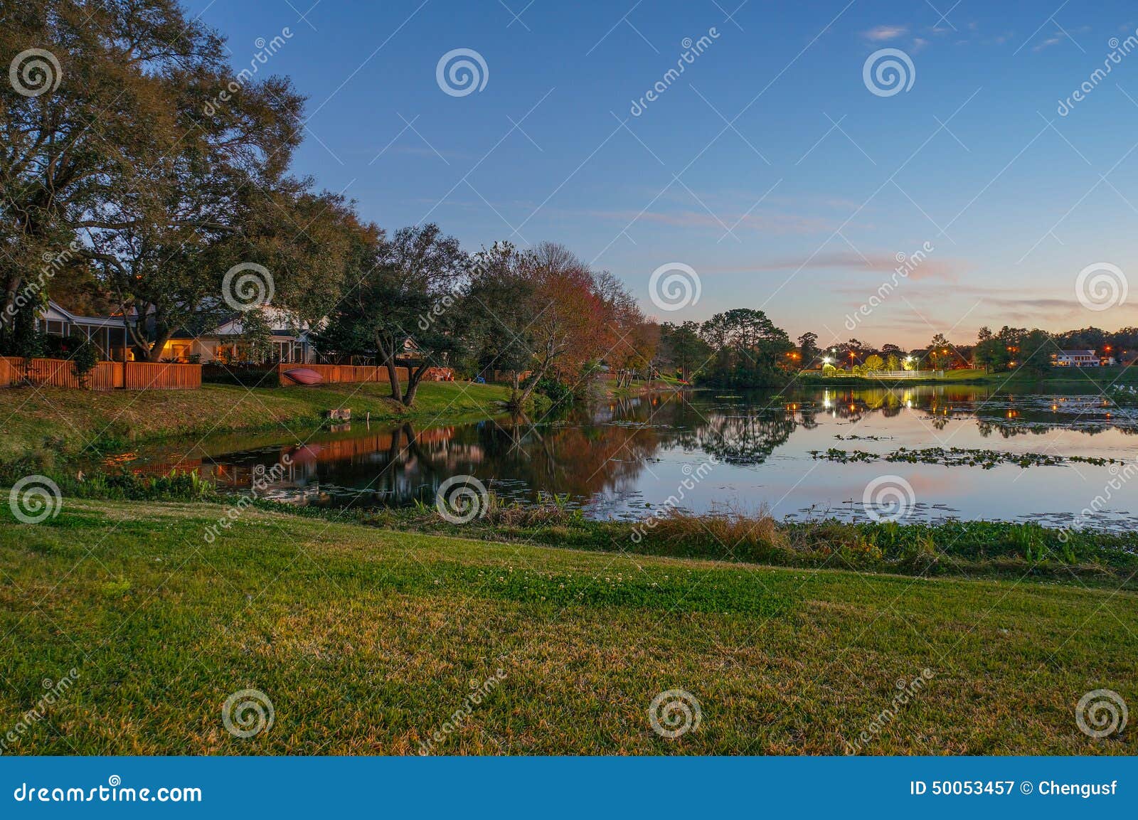 Trees and a Small Pond Form Perfect Reflection at Sunset Stock Image ...