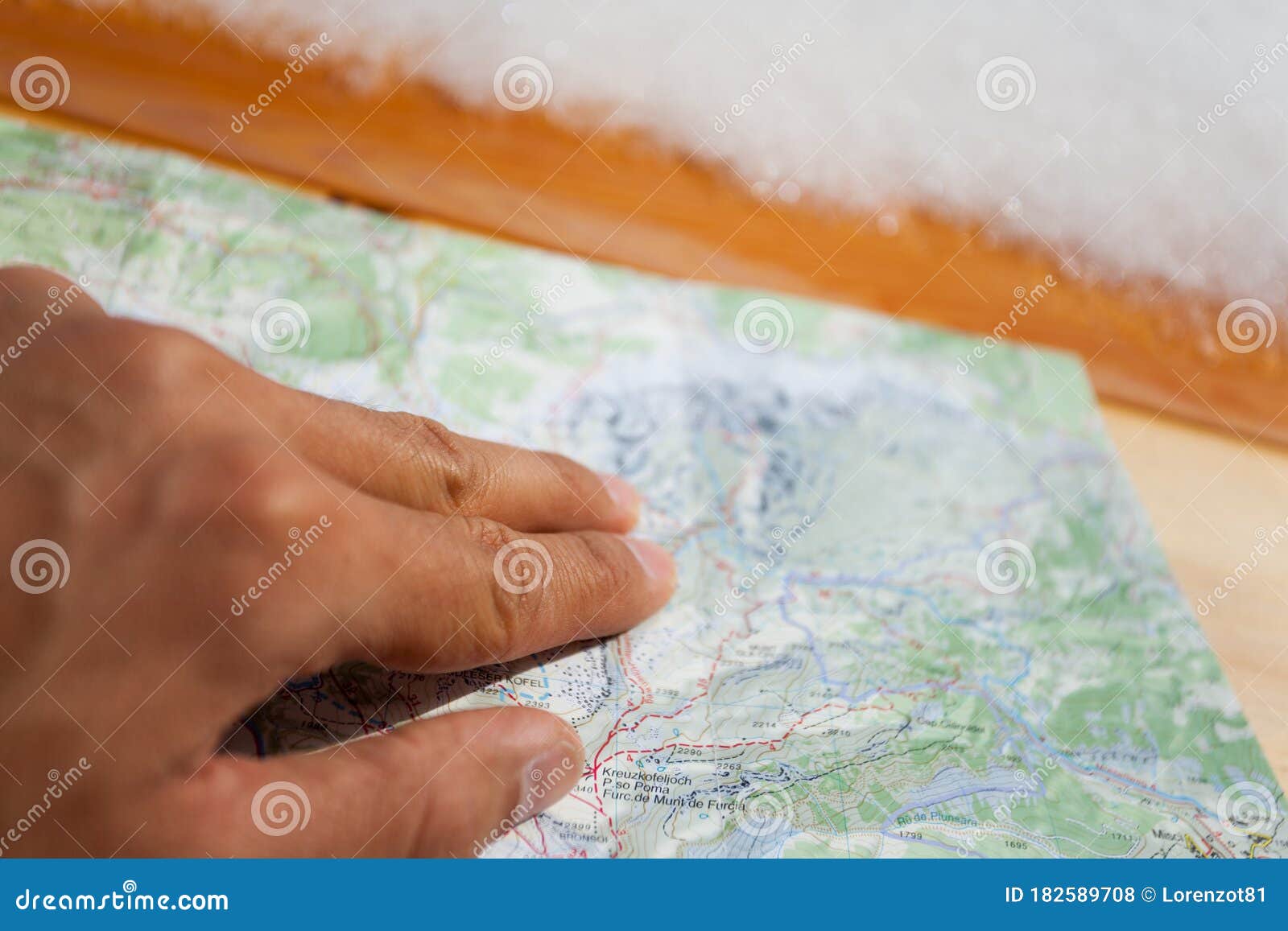 A Trekker Checking a Map during His Trip Stock Photo - Image of ...