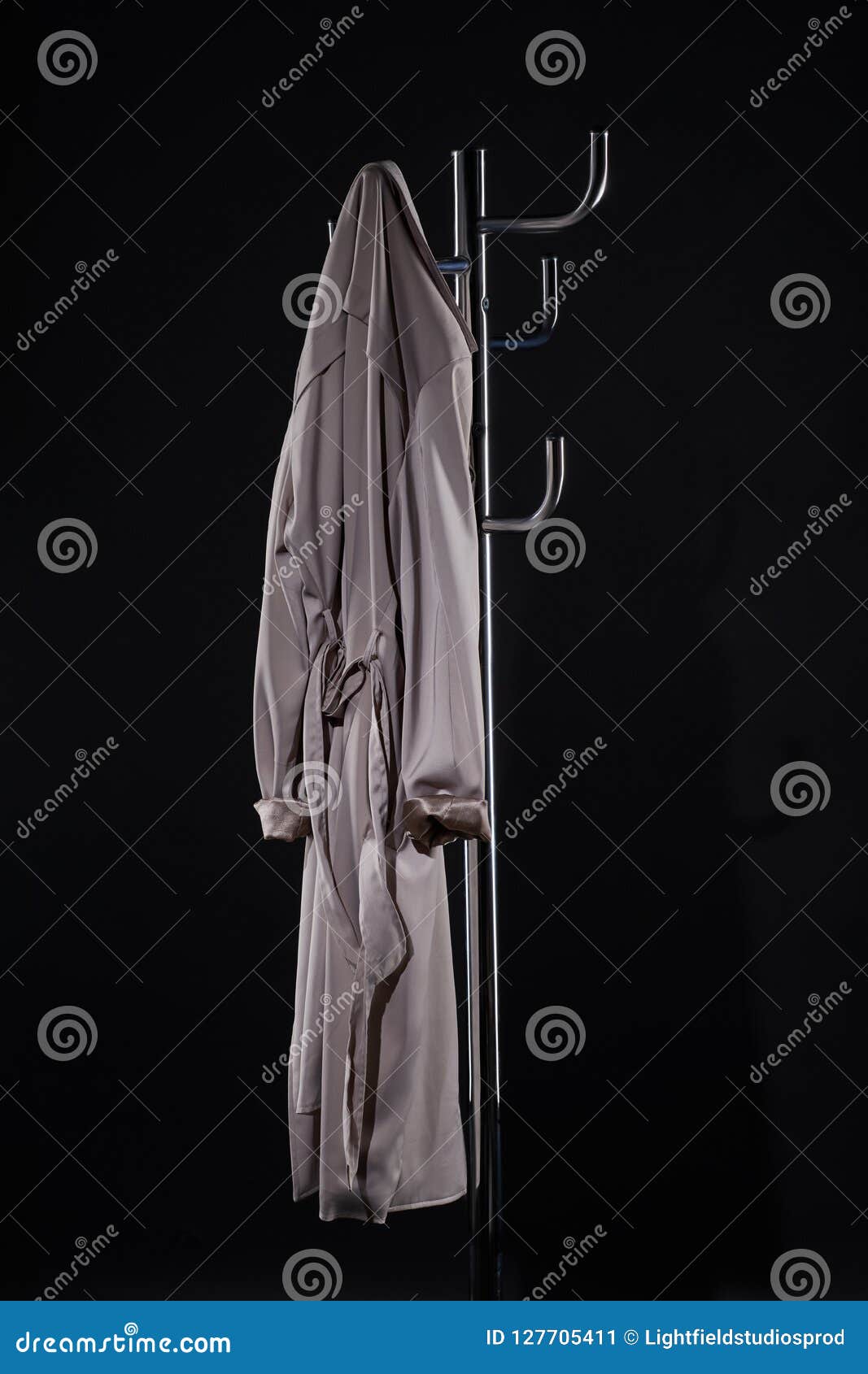 Trench Coat Hanging on Coat Rack Isolated on Black Stock Image - Image ...