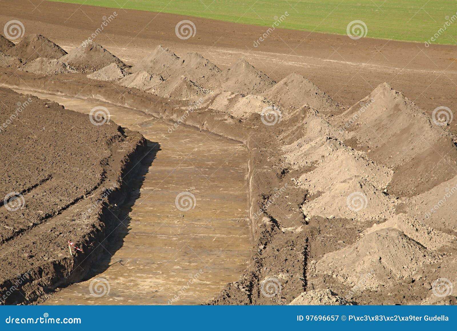 Trench digged on a land stock image. Image of digging - 97696657
