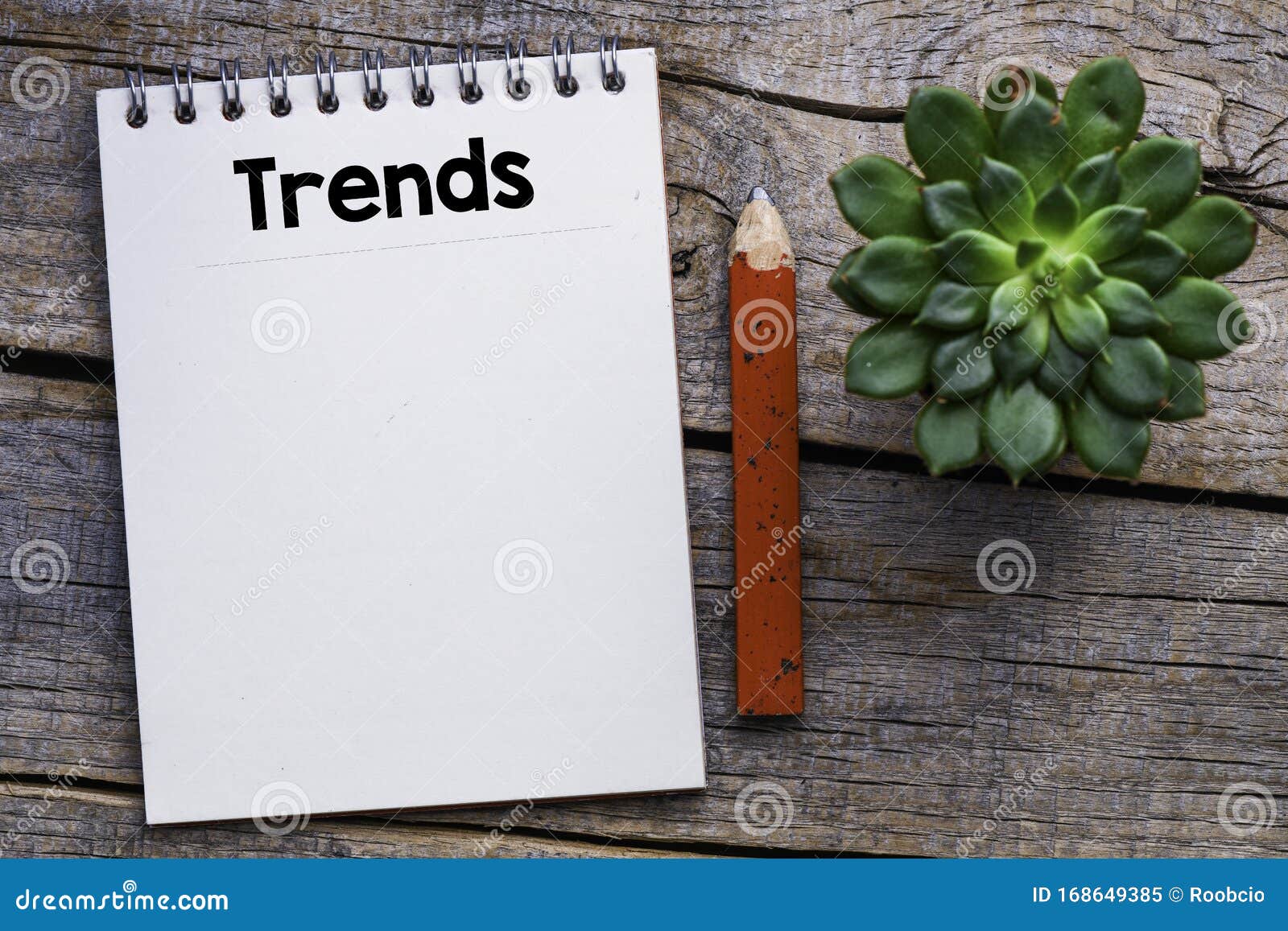 Trends Text Written in Notes on a Wooden Table, Top View. Business ...
